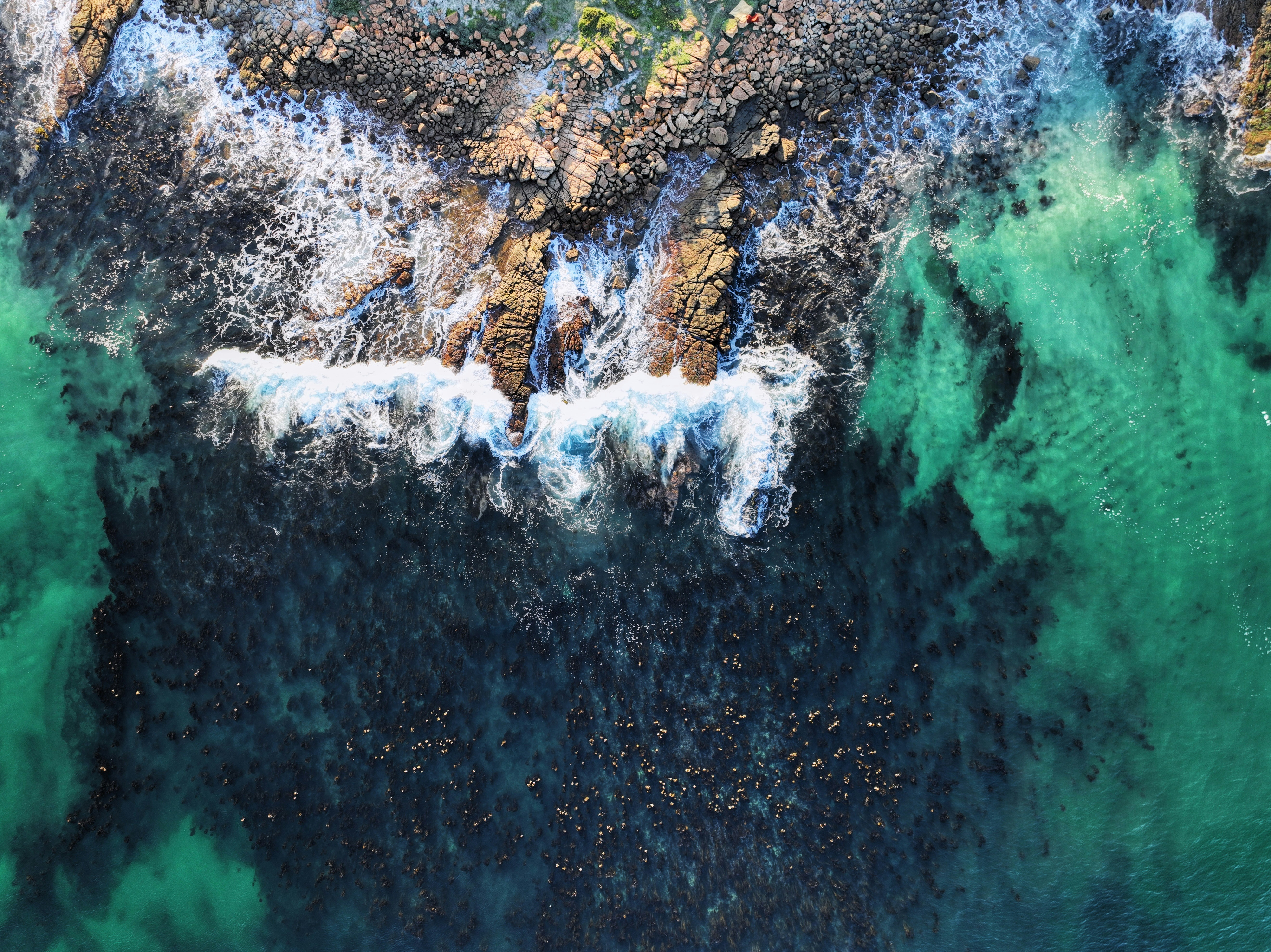 a bird's eye view of the ocean and rocksSimon Barber