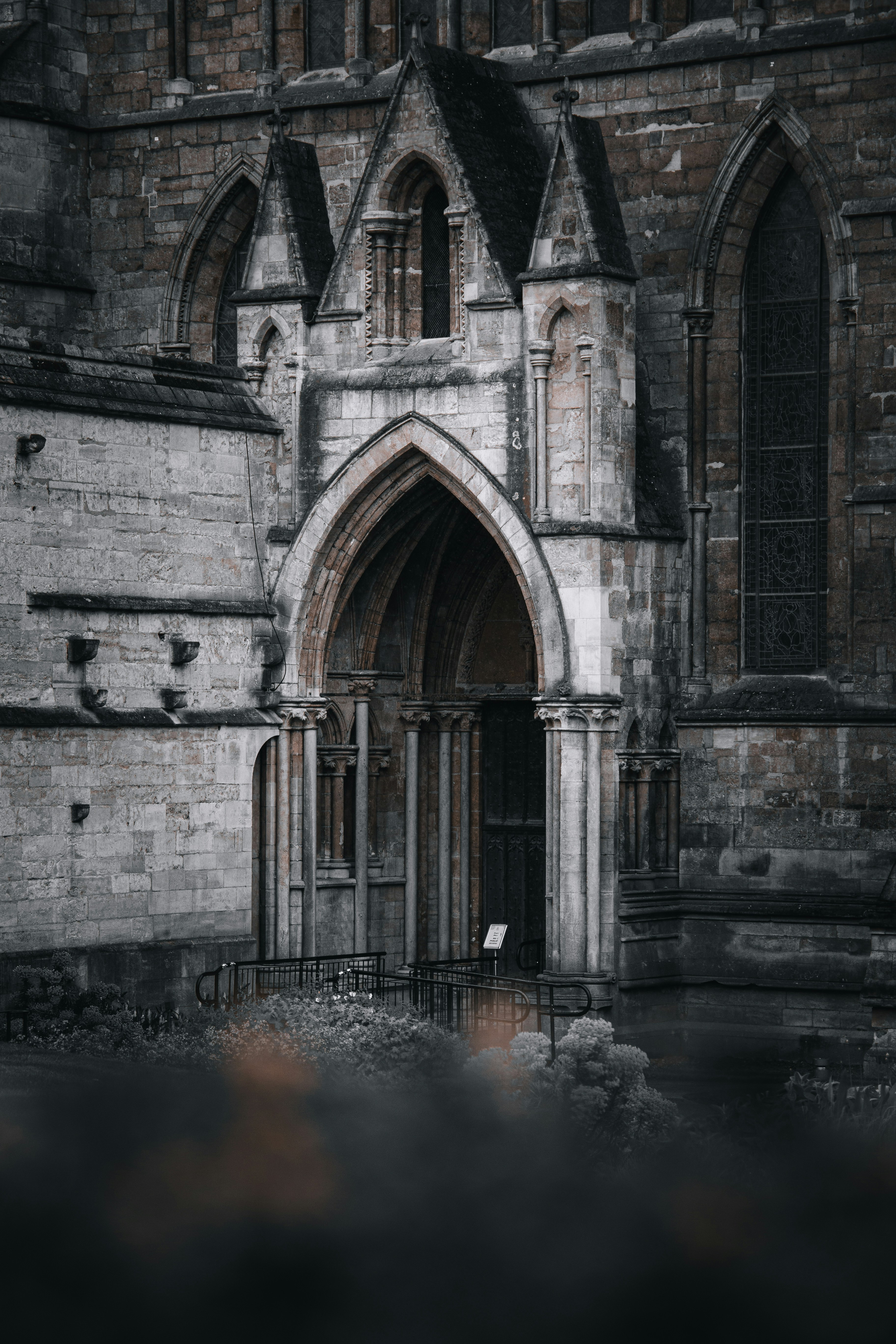 Midnight Portal: Weathered Gothic Gate Amid Stone Turrets