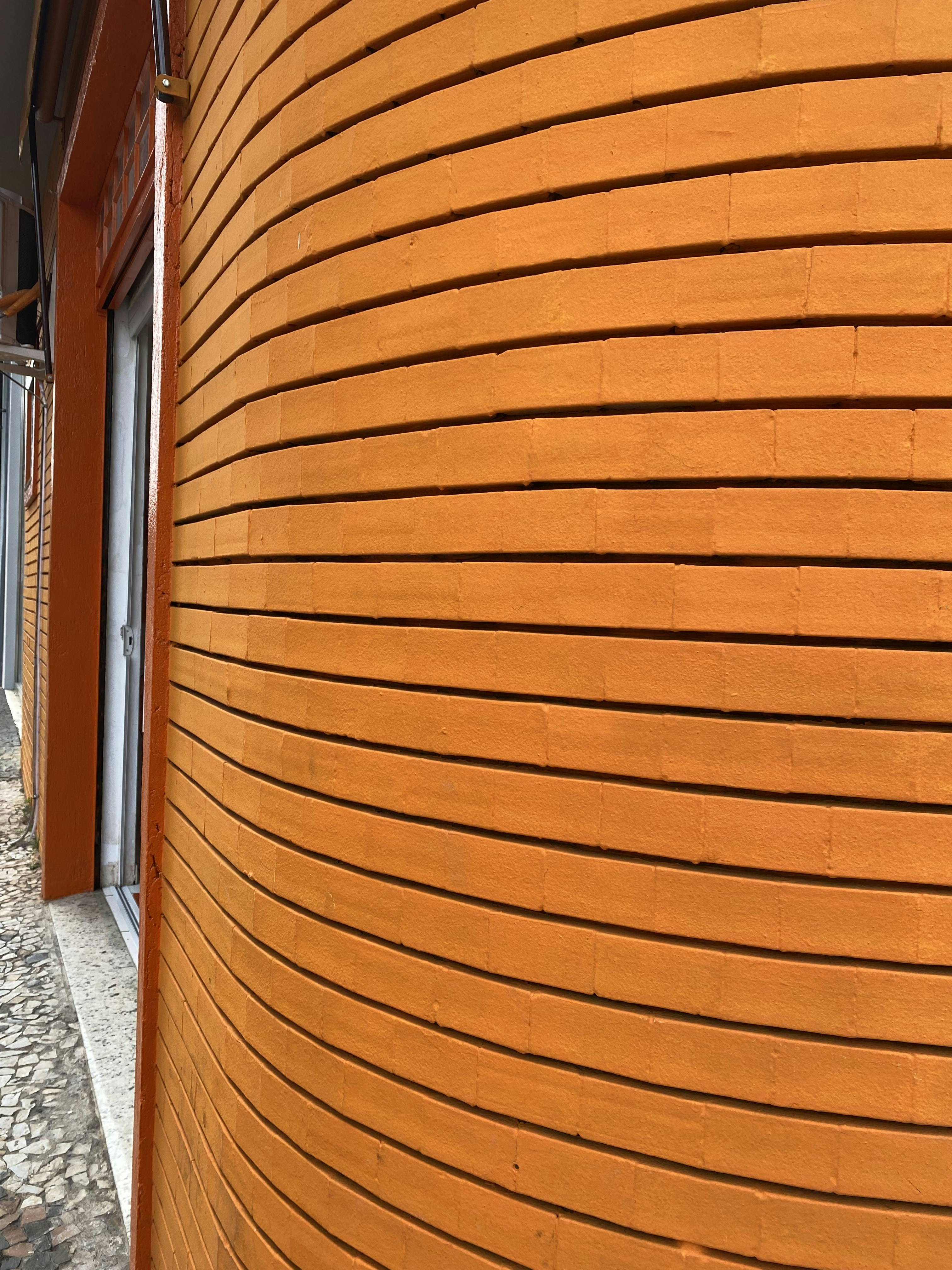 Rhythms of a Curved Orange Brick Wall