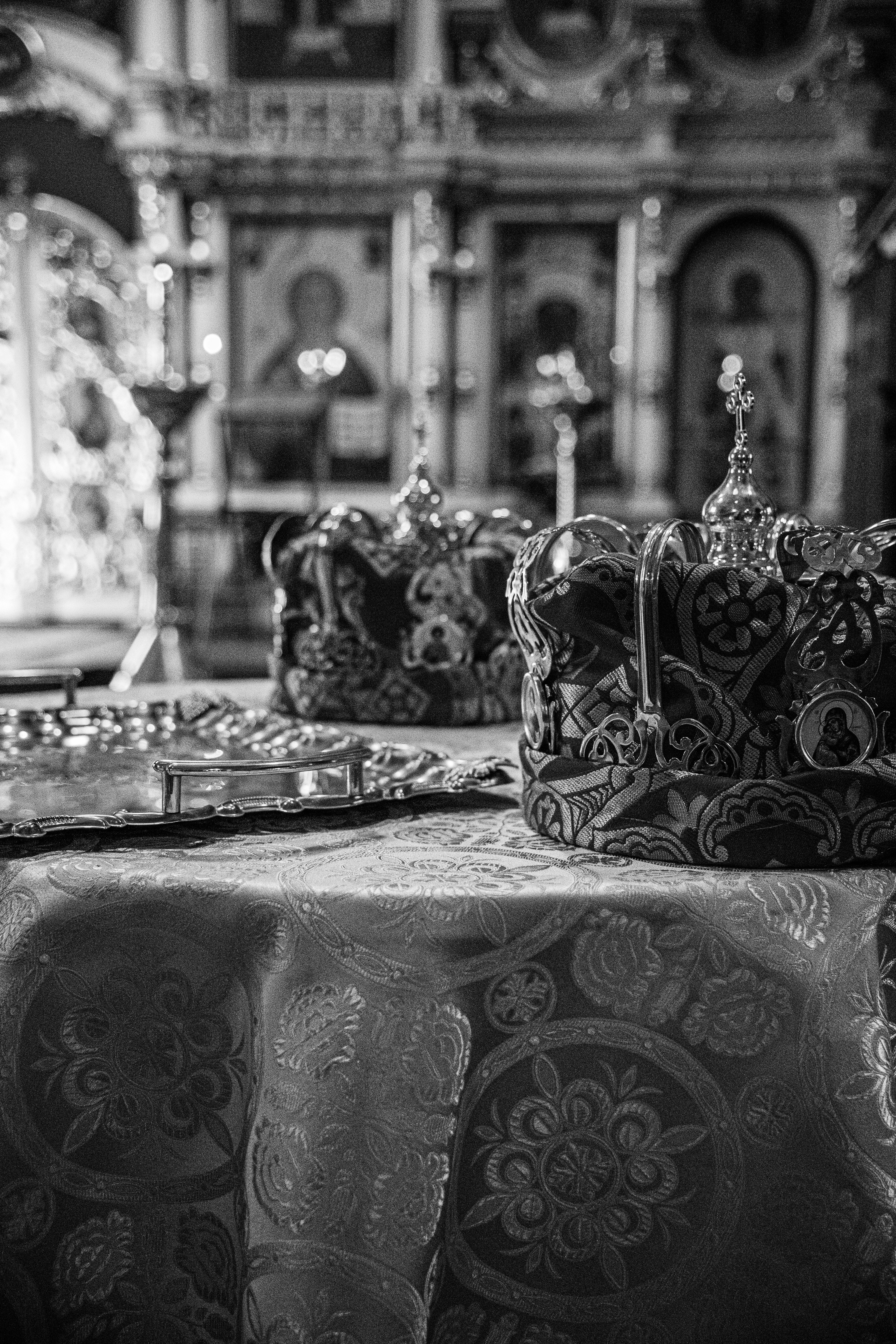 Crown Cluster on a Patterned Table in a Dim Orthodox Church Interior