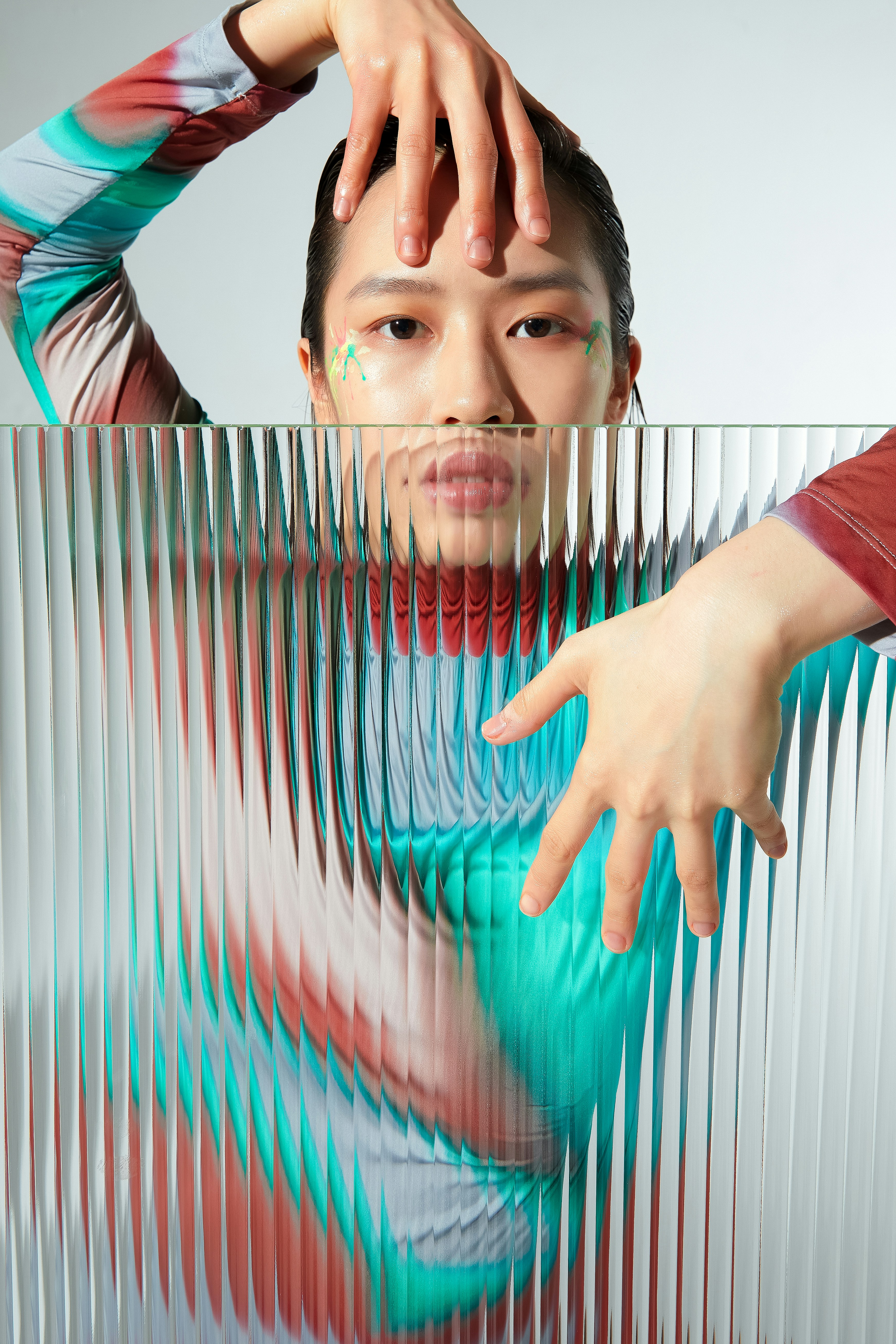 A young man holding his hands over his face photo – Free Fashion Image ...