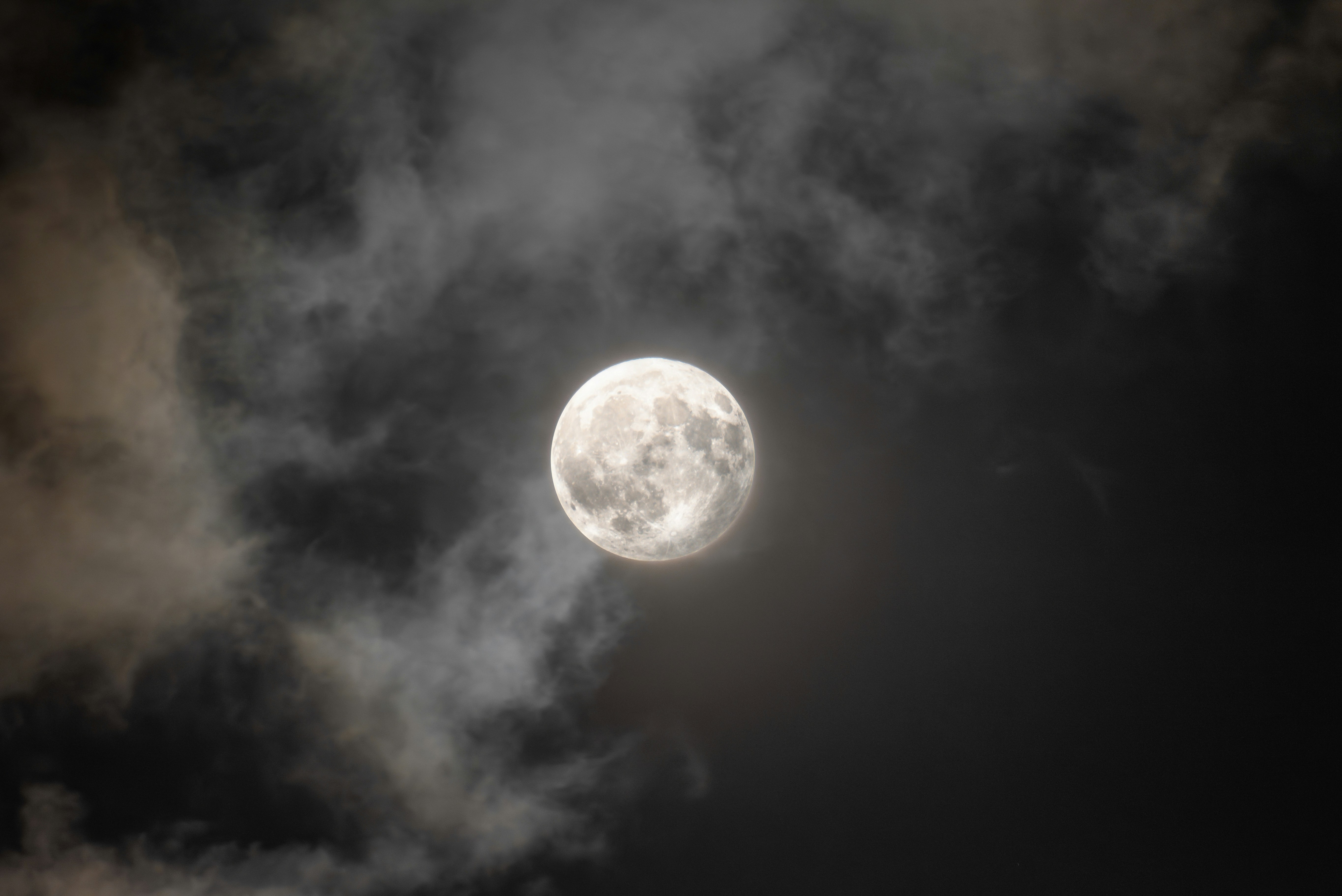 A full moon is seen through the clouds photo – Free Moon Image on Unsplash