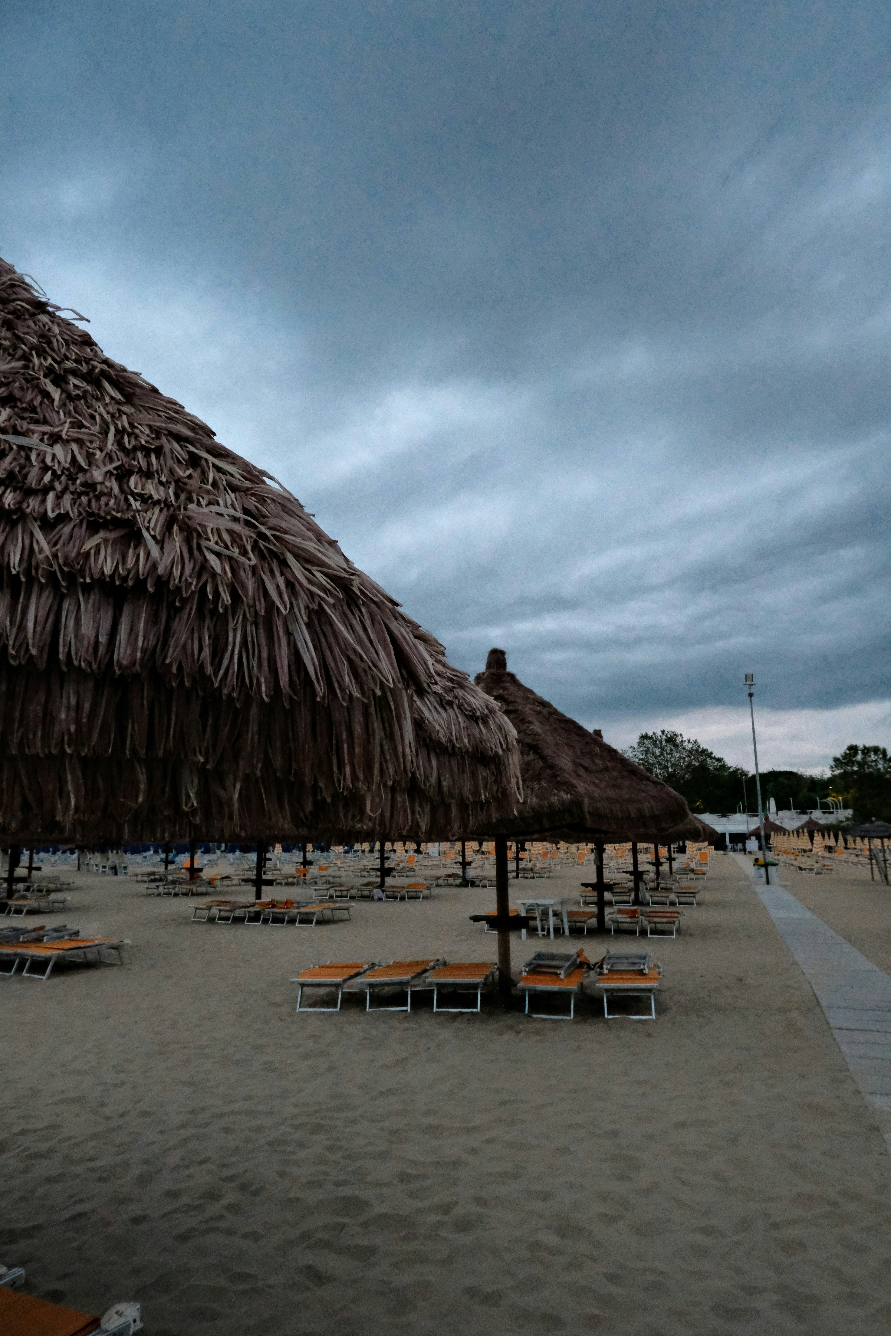 Stormy Skies Over Deserted Beach Huts