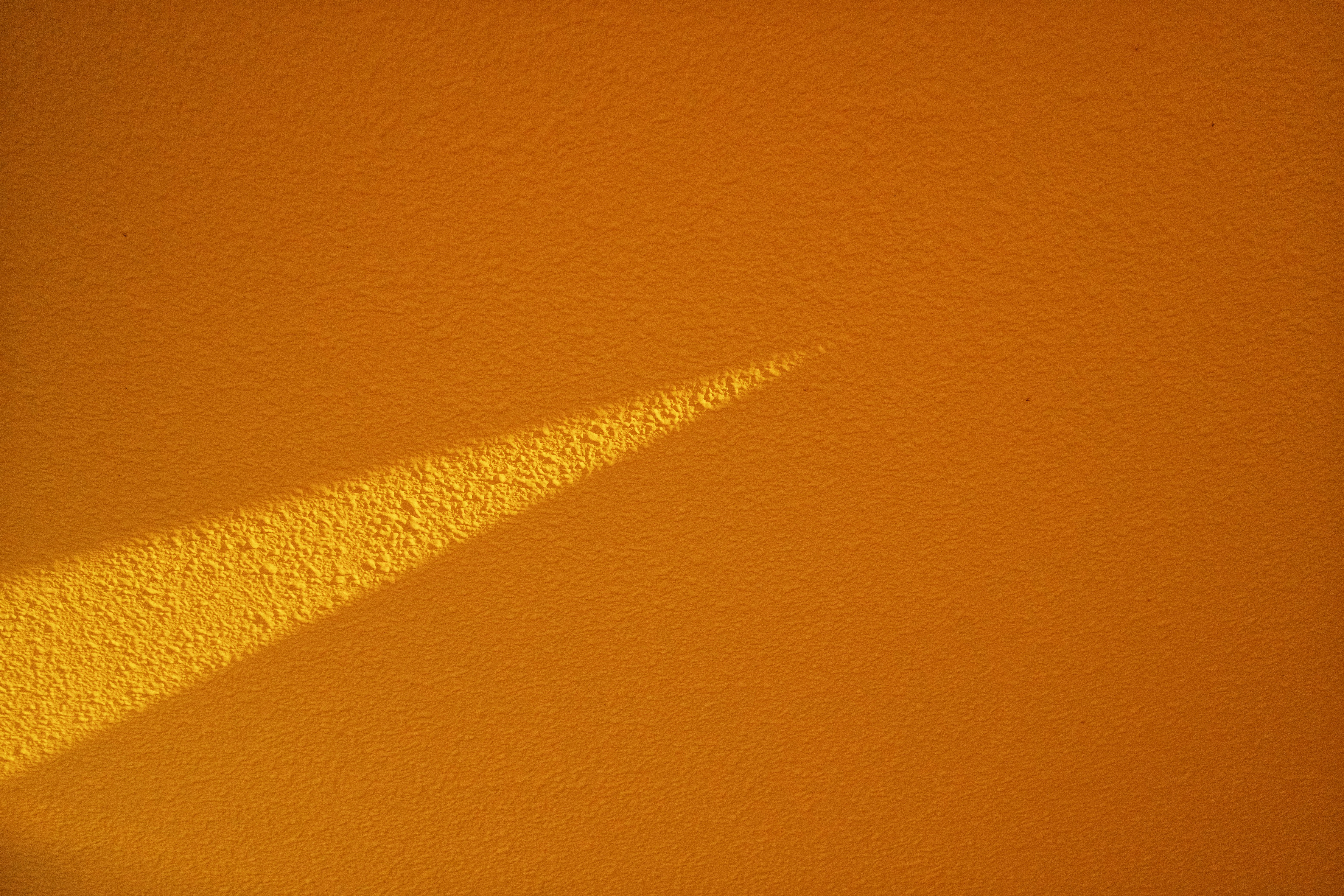 The shadow of a light shining on a wall photo – Free Texture Image on ...