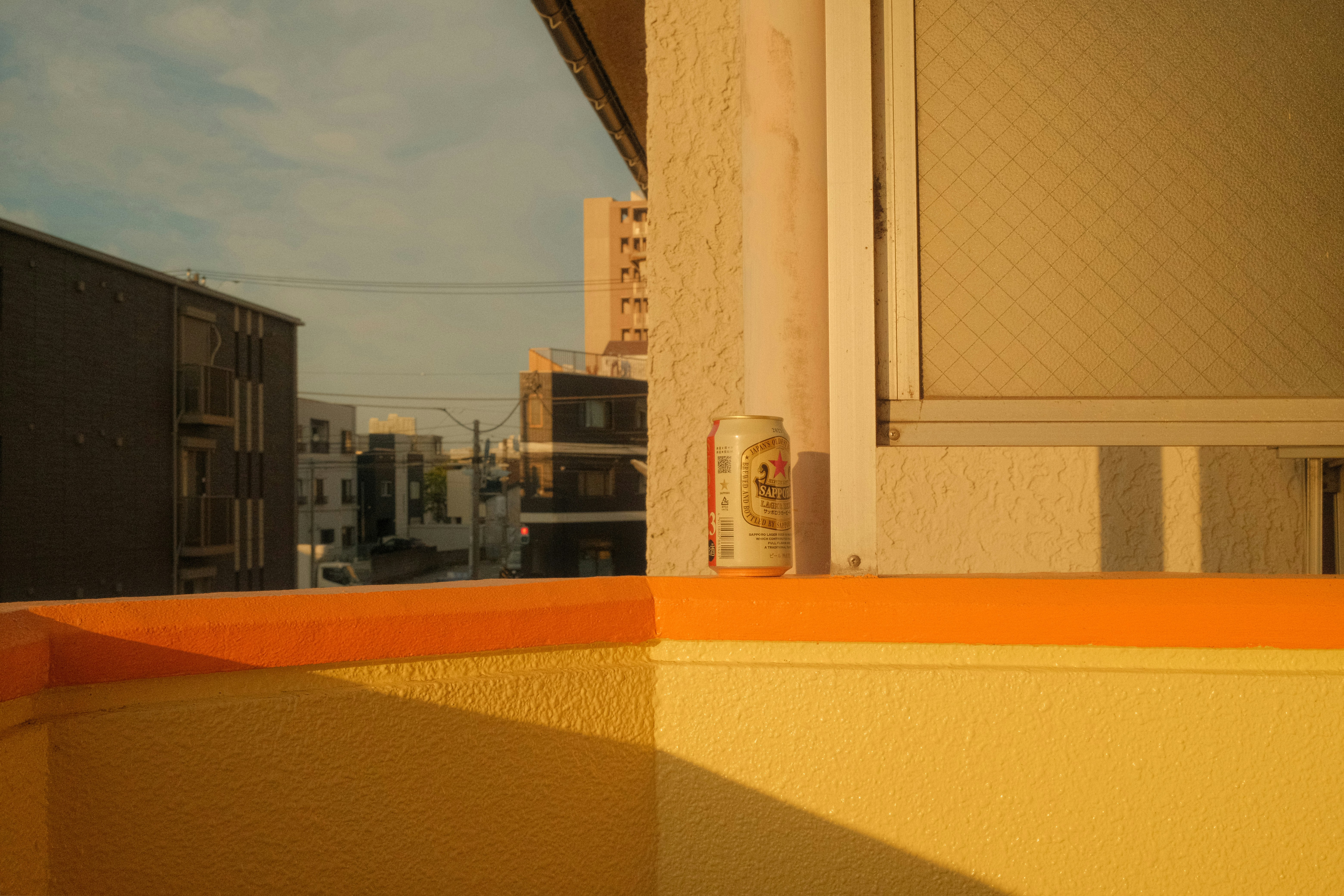 Edge of Daylight: Can Resting on a Sunlit Balcony Railing