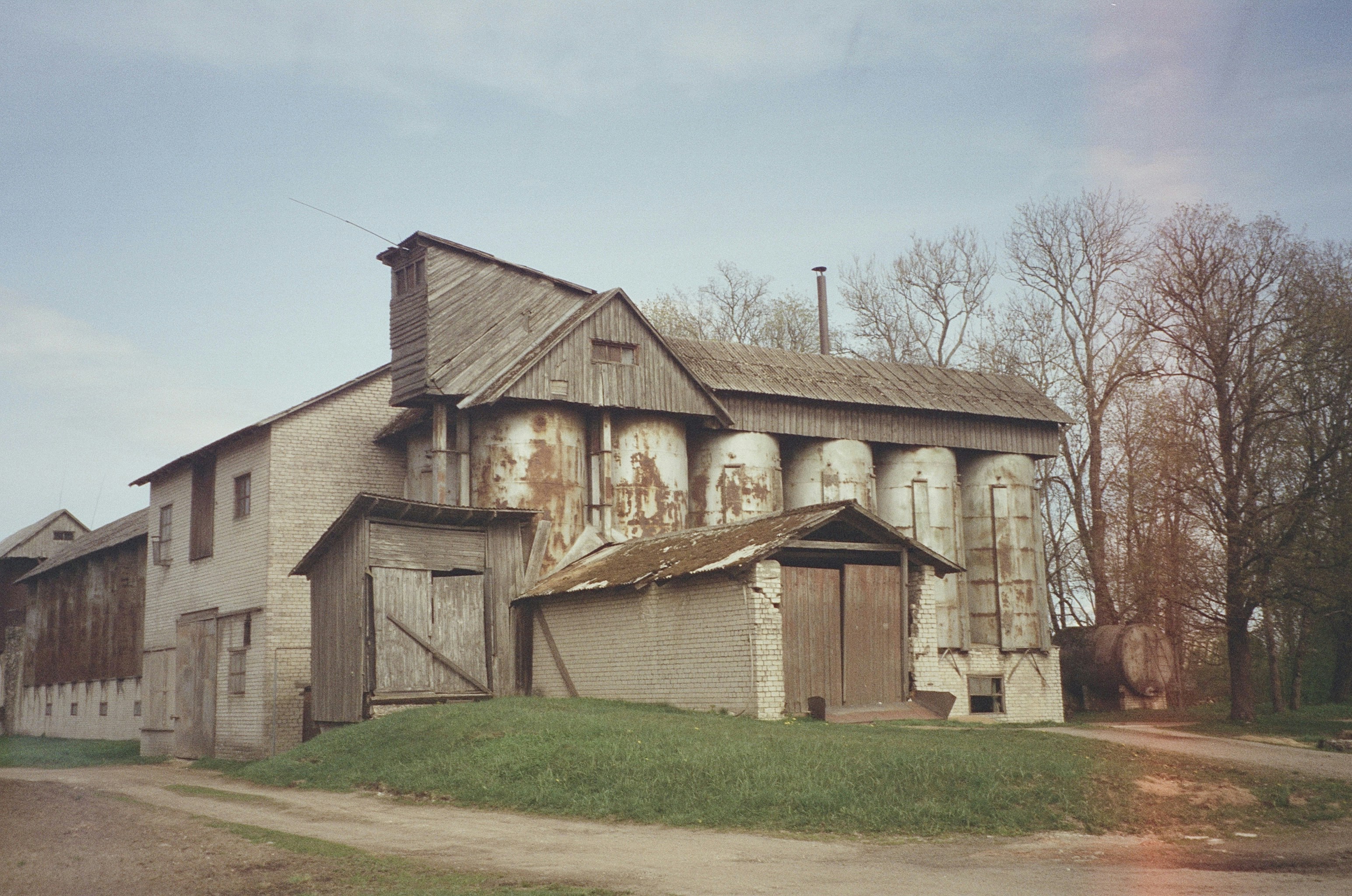 A run down building with a lot of windows photo – Free Latvia Image on ...