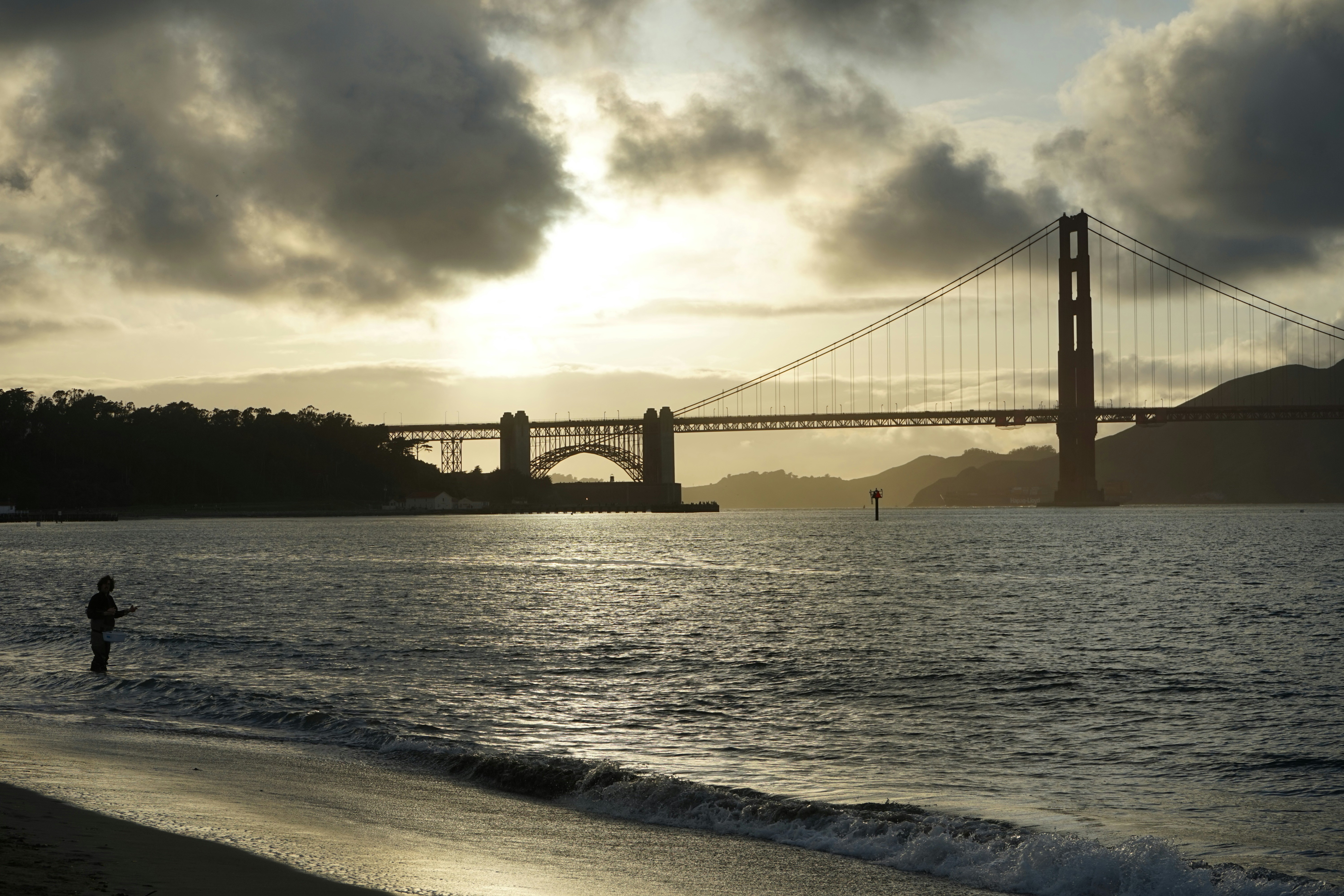 Silhouetted Serenity: A Fisherman's Evening by the Bay