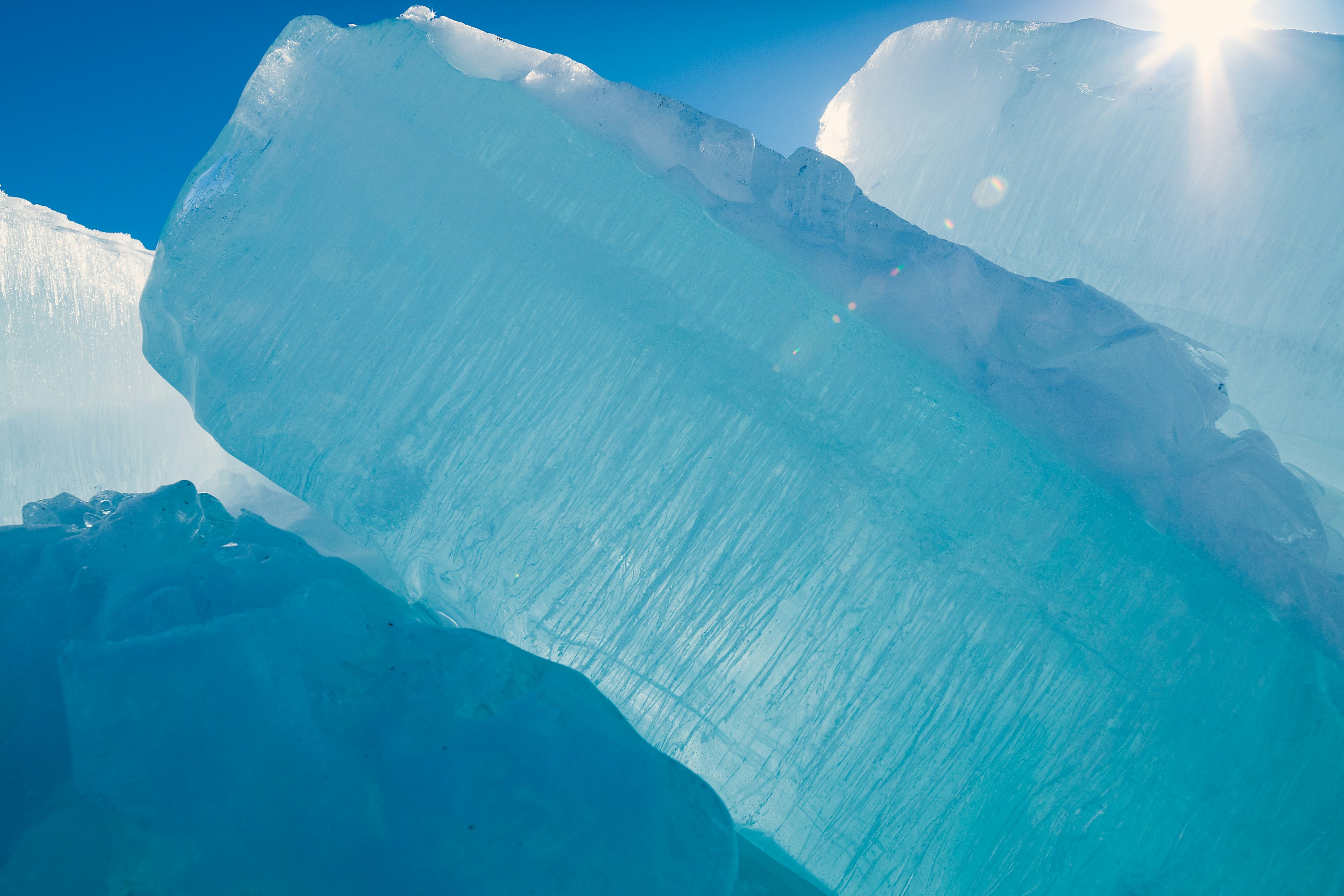 Diagonal Prism of Blue Ice Under a Polar Sun