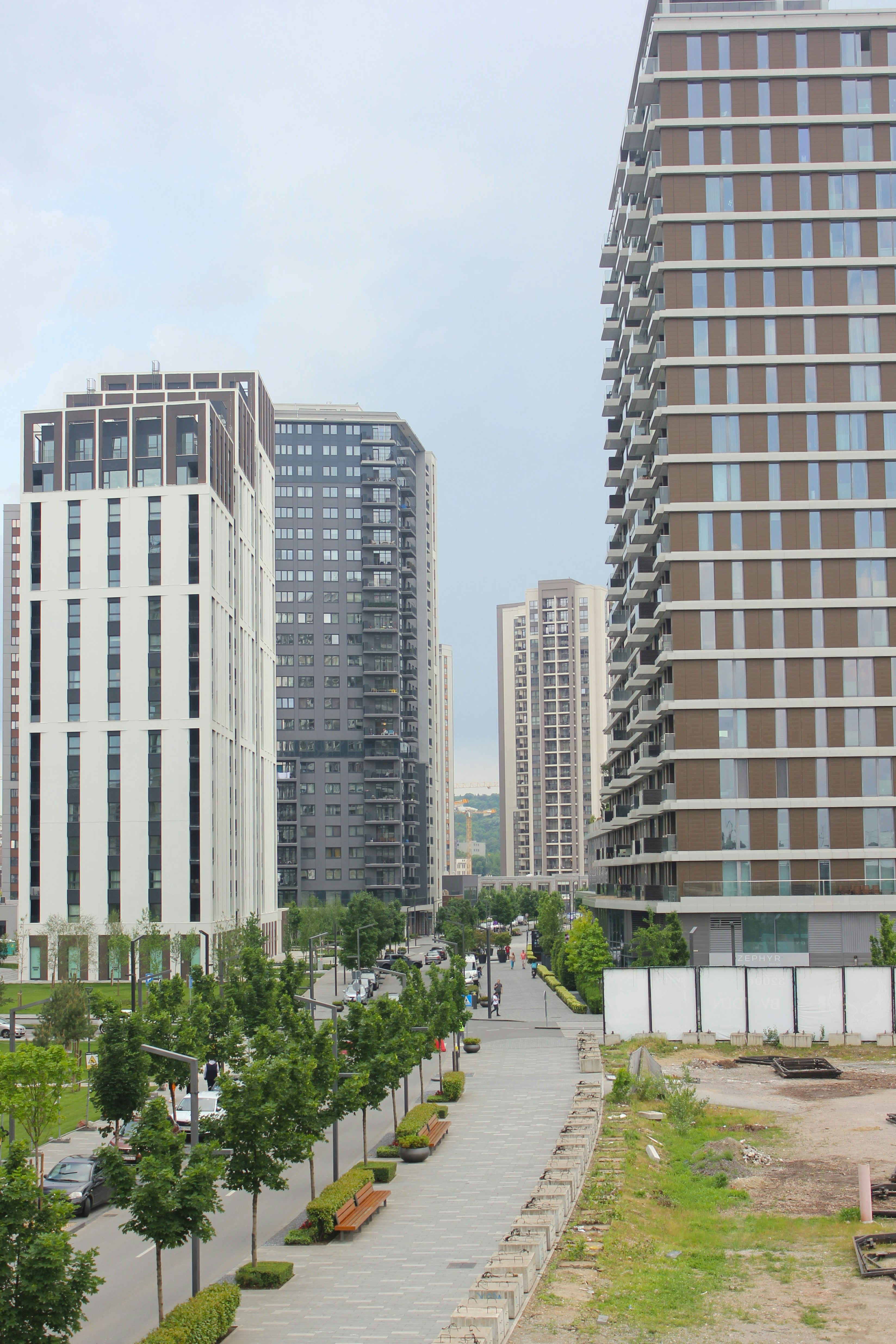 a couple of tall buildings sitting next to each other