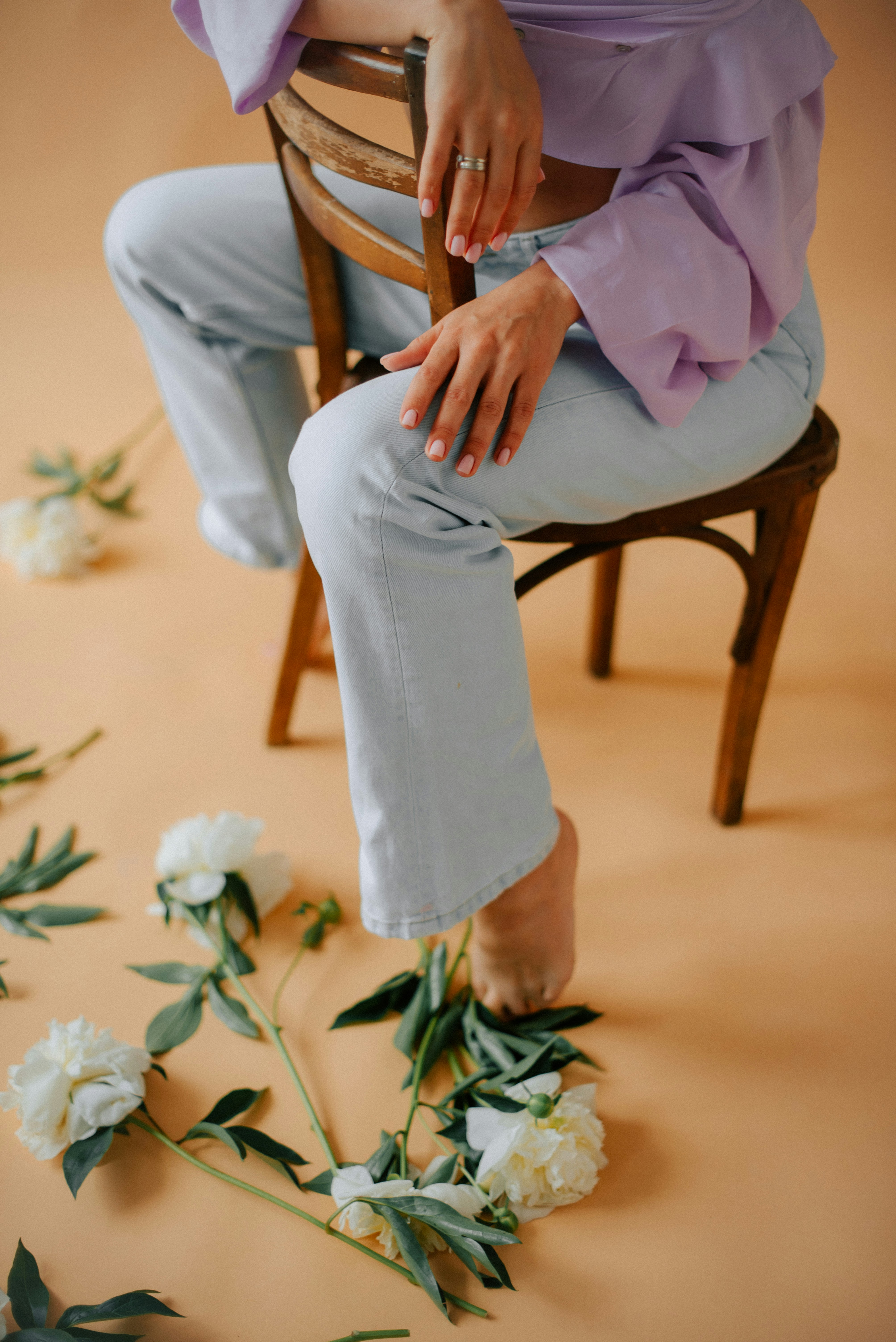 Solemn Poise: A Quiet Moment Among White Roses