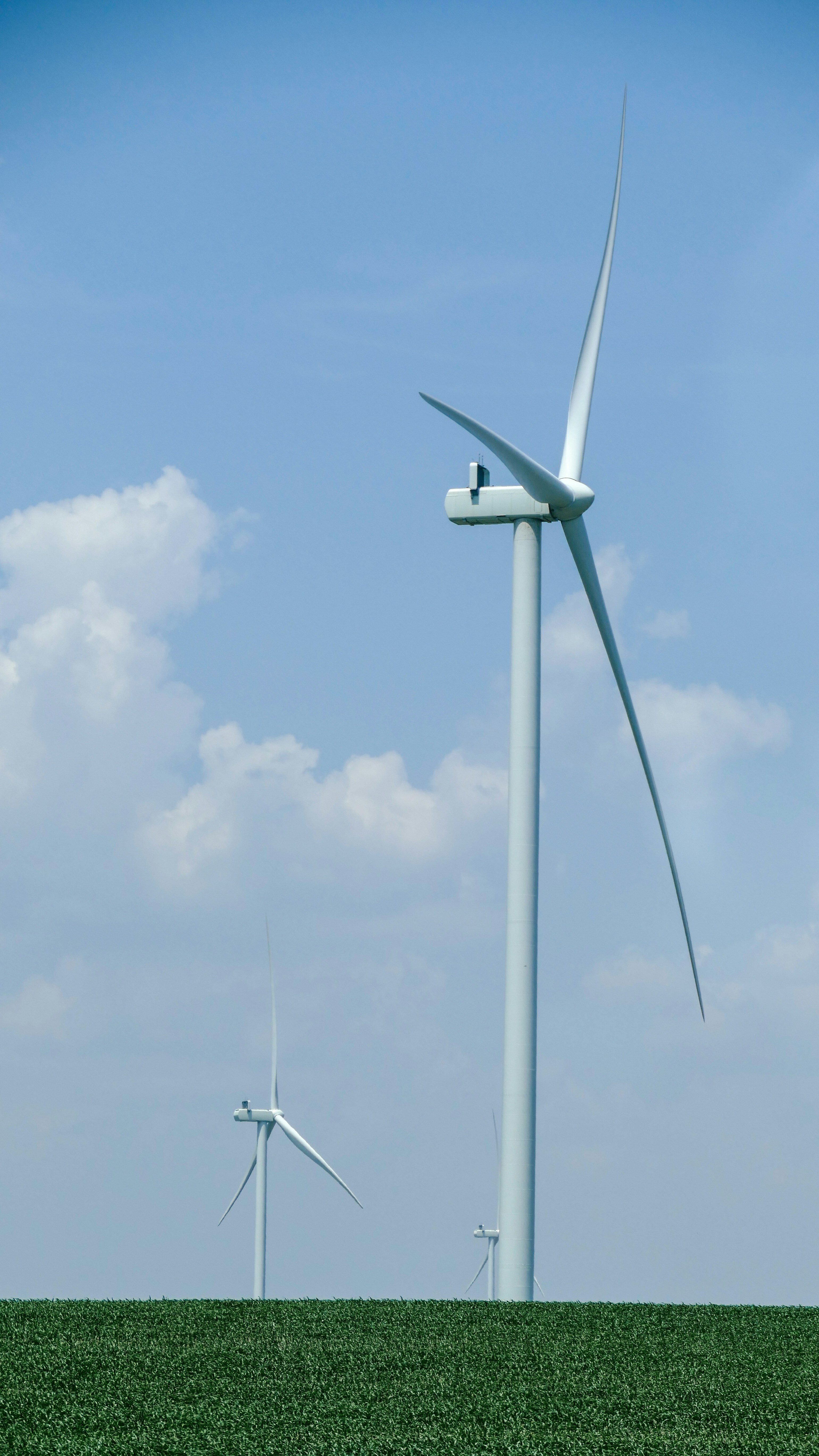 A group of wind turbines in a field photo – Free Architecture Image on ...