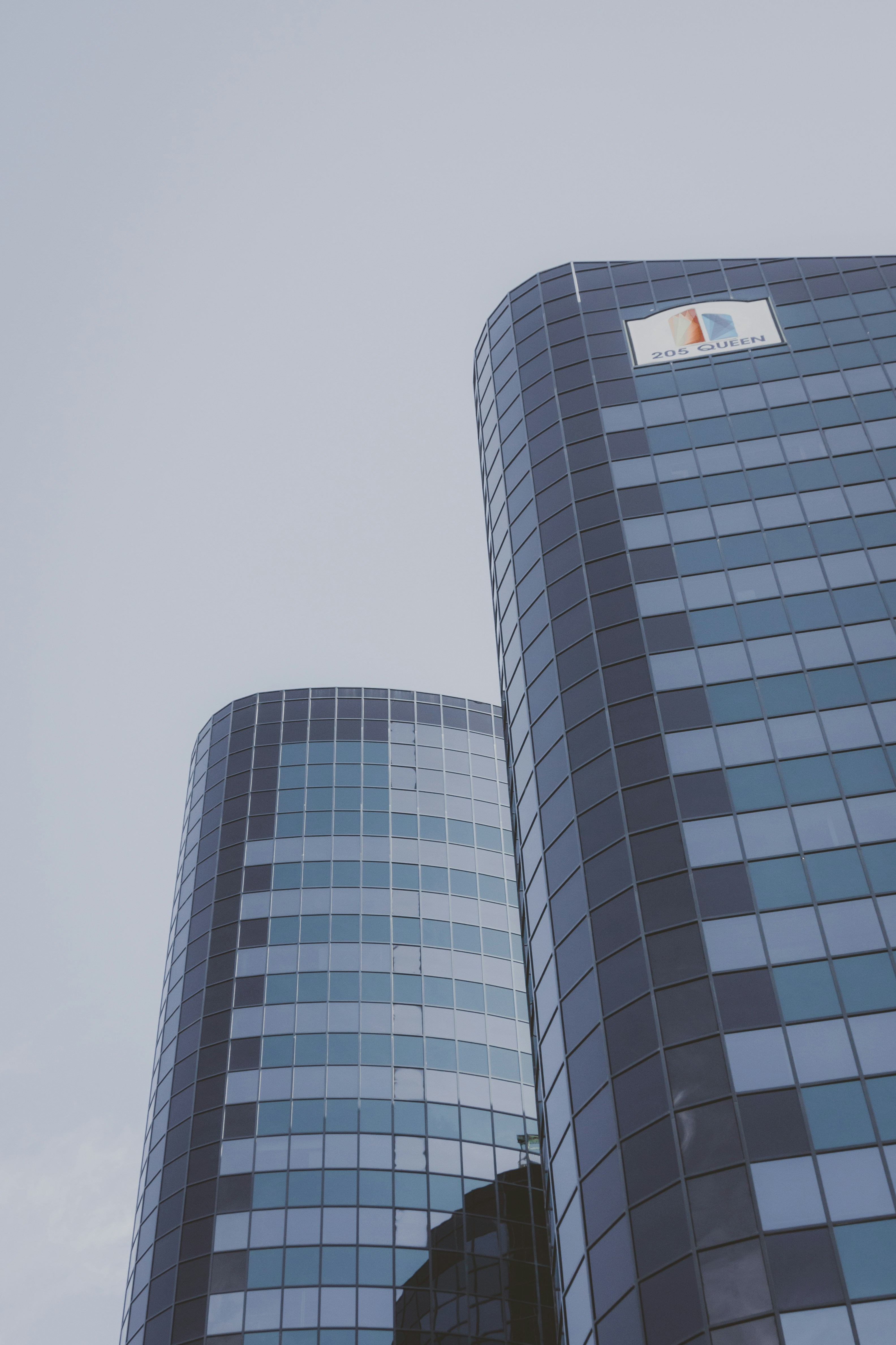 Twin Glass Curves Rise: A Minimalist Skyline of Steel and Sky