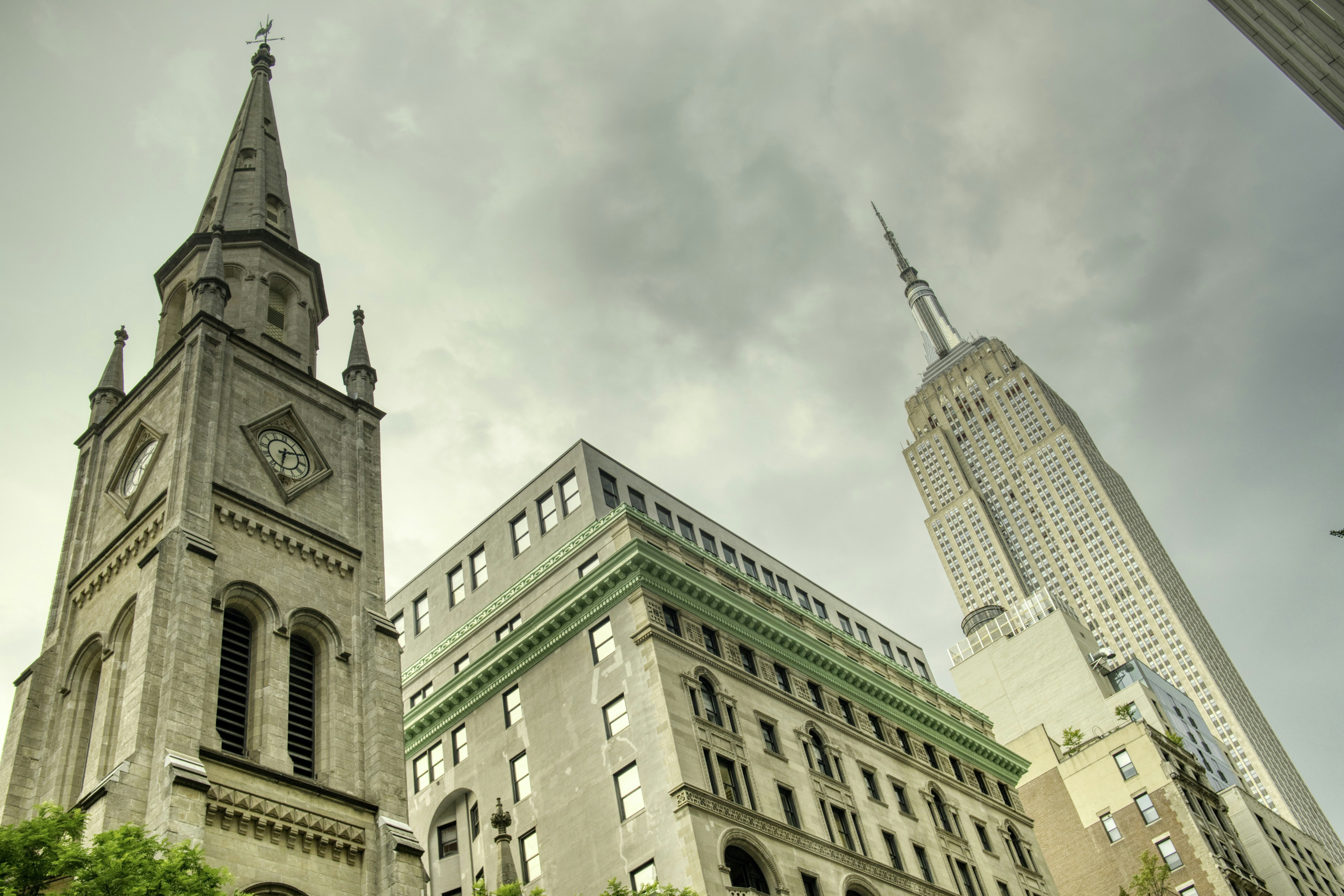 Skyward Convergence: Stone, Brick, and Steel in Tilted Light
