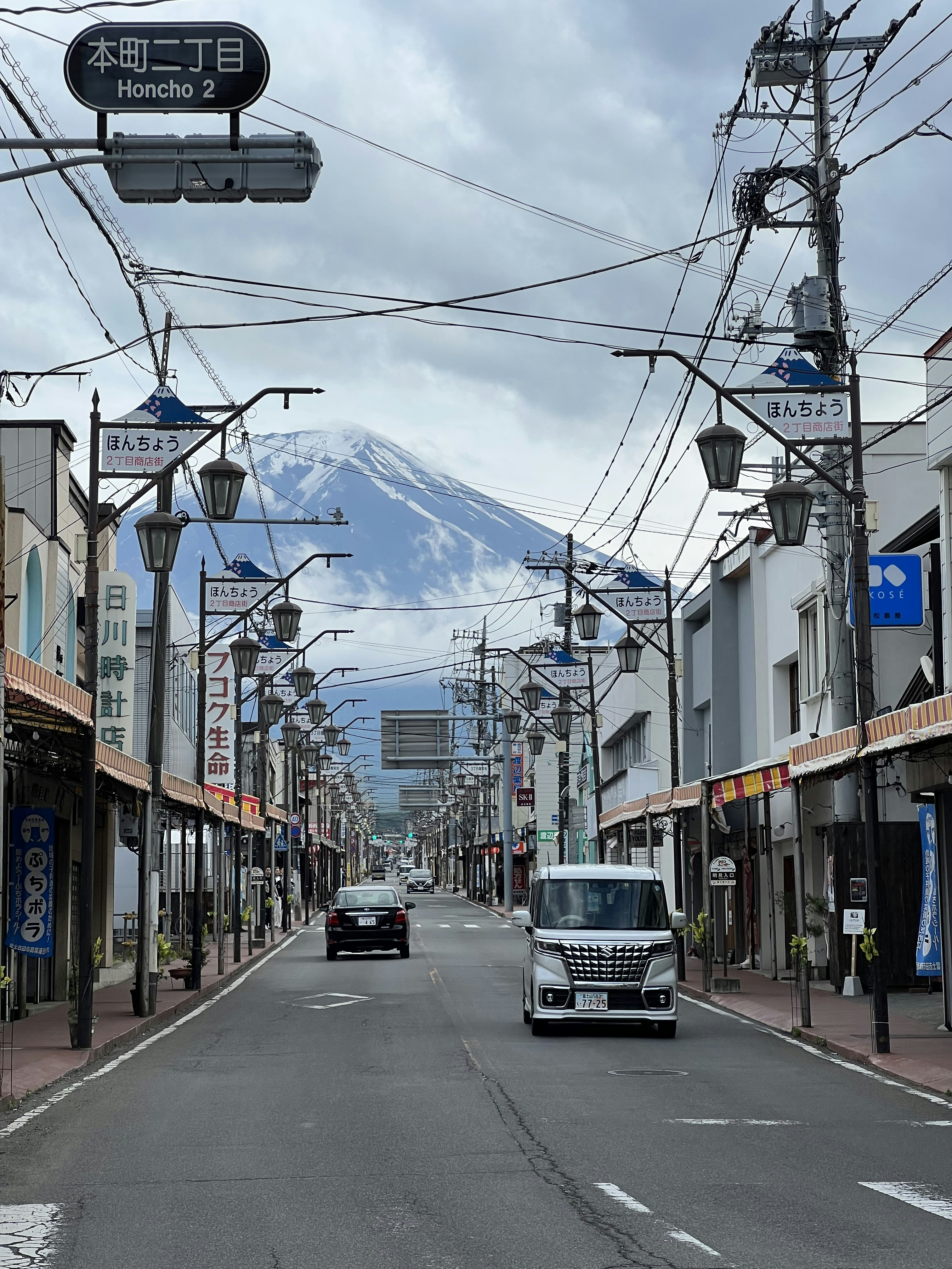 Fuji in Focus: Snow-Capped Summit Framed by a Japanese Avenue