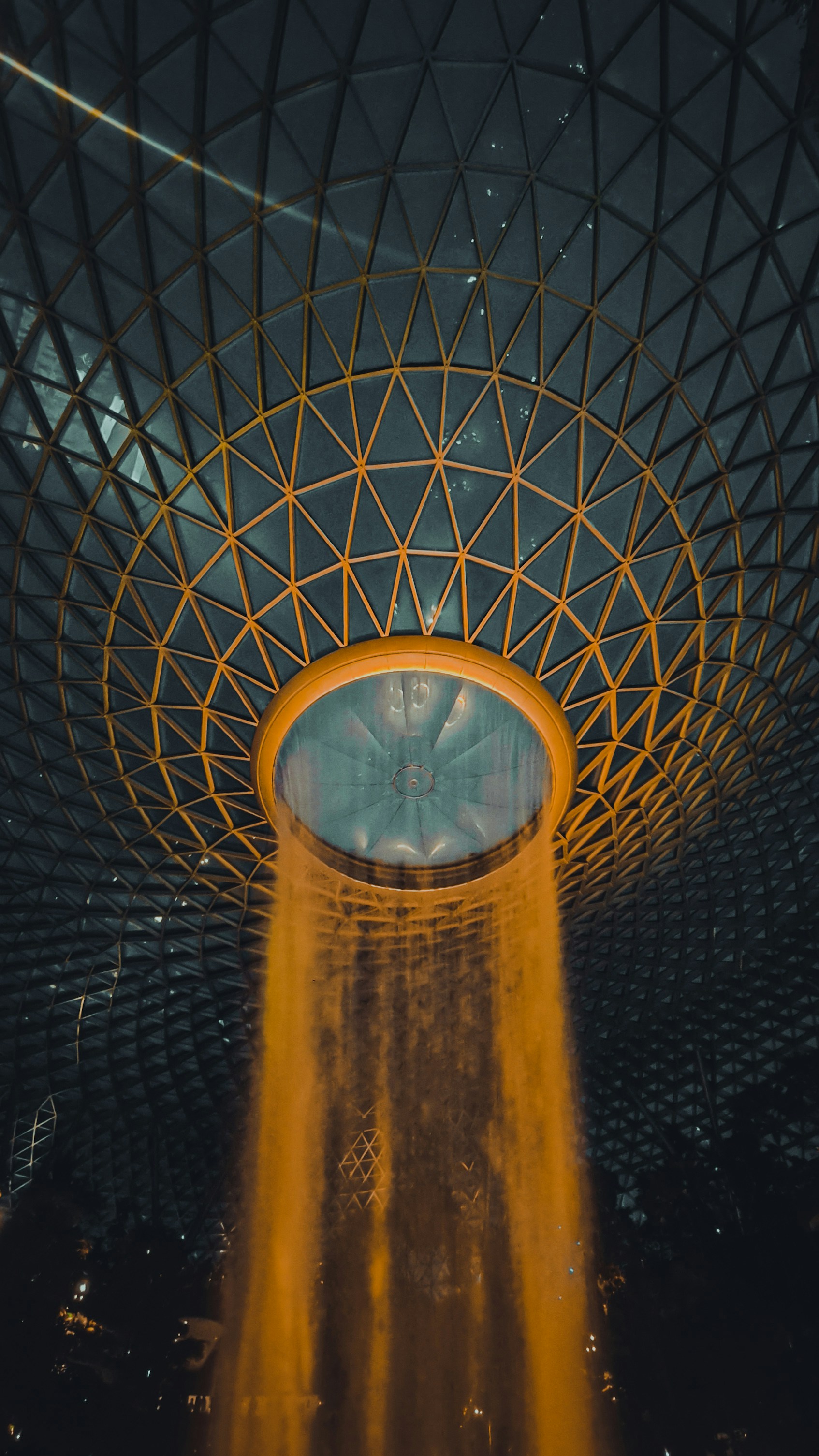 Amber Cascade Beneath the Geodesic Dome