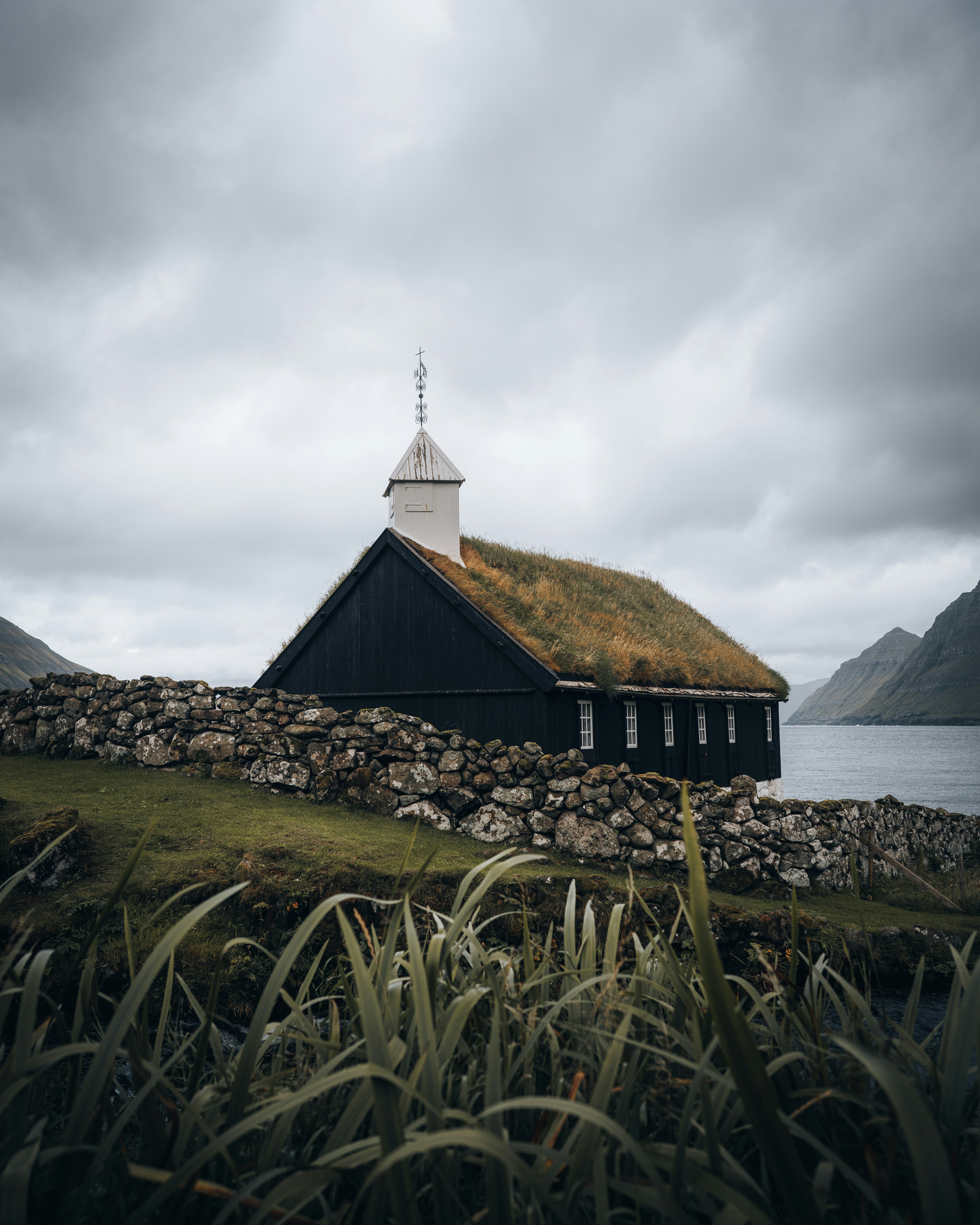 Turf-Roofed Black House Guards the Fjord