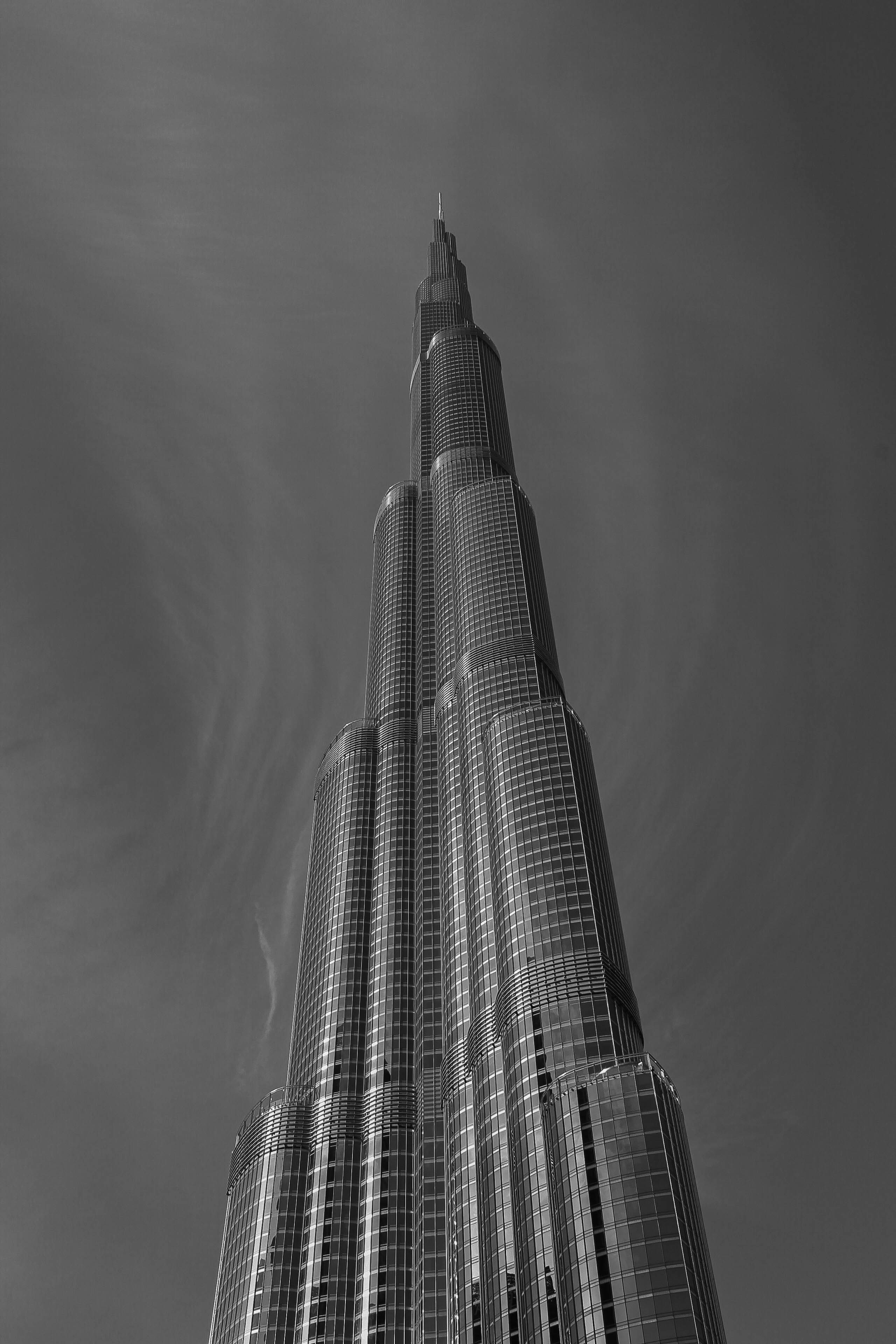 A black and white photo of a very tall building photo – Free Burj ...