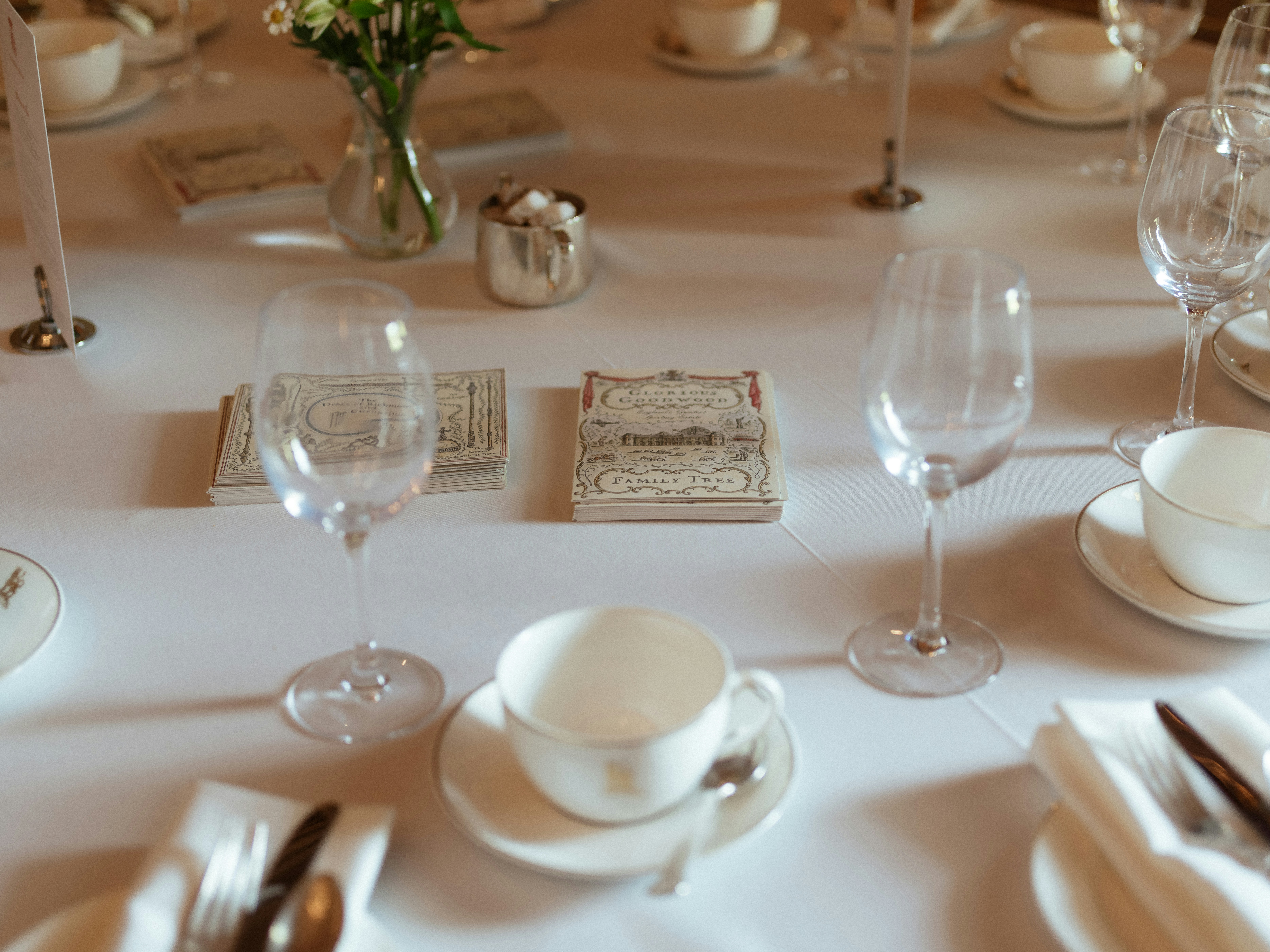 A table set for a formal dinner with place settings photo – Free ...