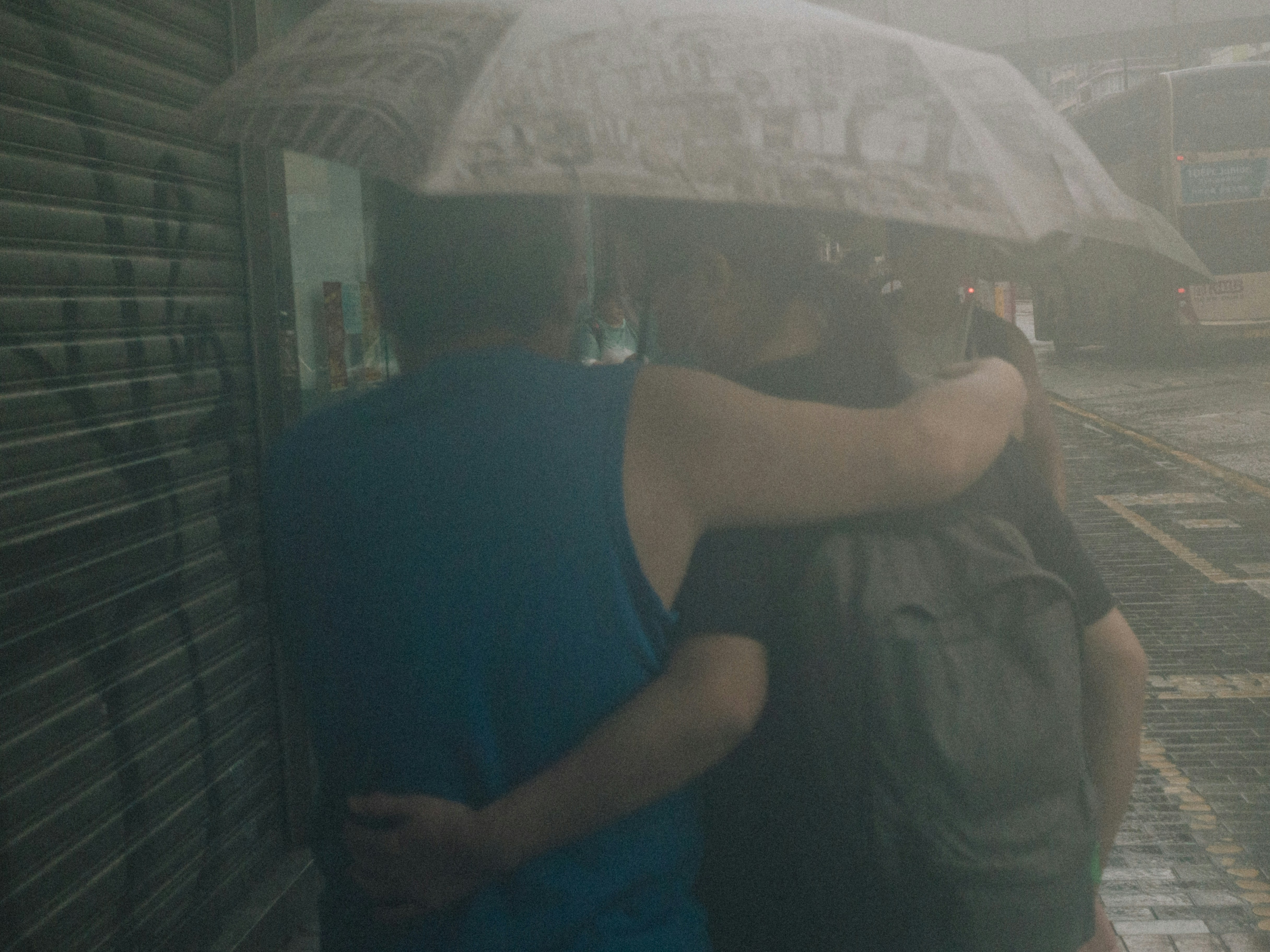 Umbrella Union on a Rain-Slick City Street