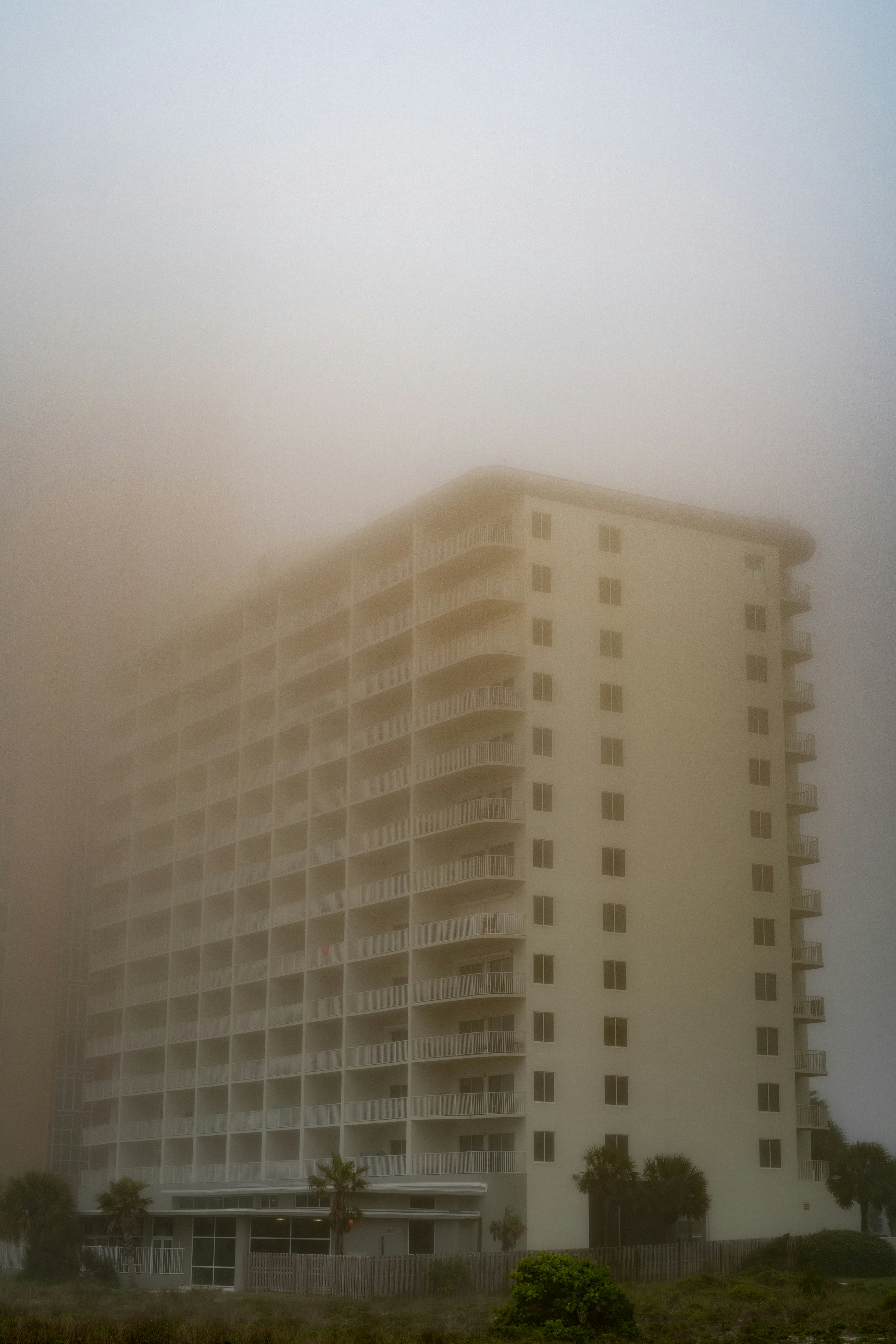Mist-Clad Tower Emerges: A Quiet Dawn Among the Fog