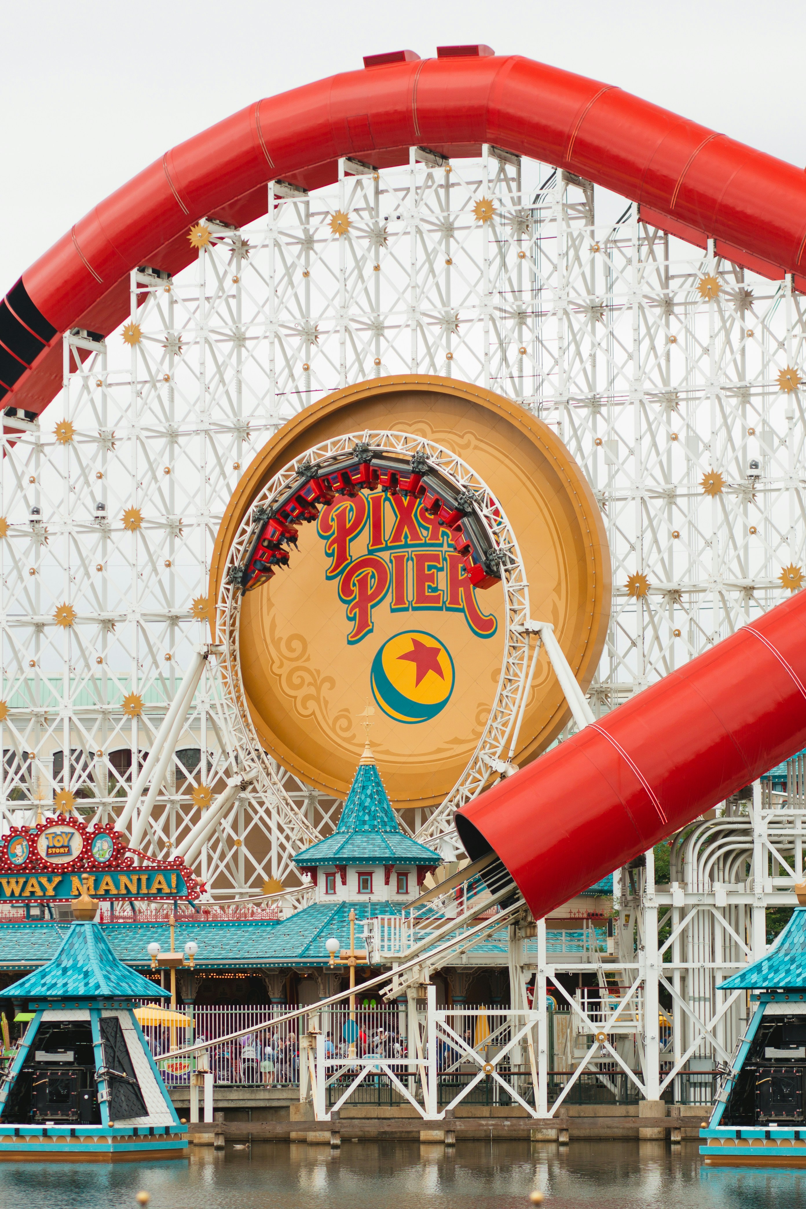 A carnival ride with a giant red tube in front of it photo – Free ...