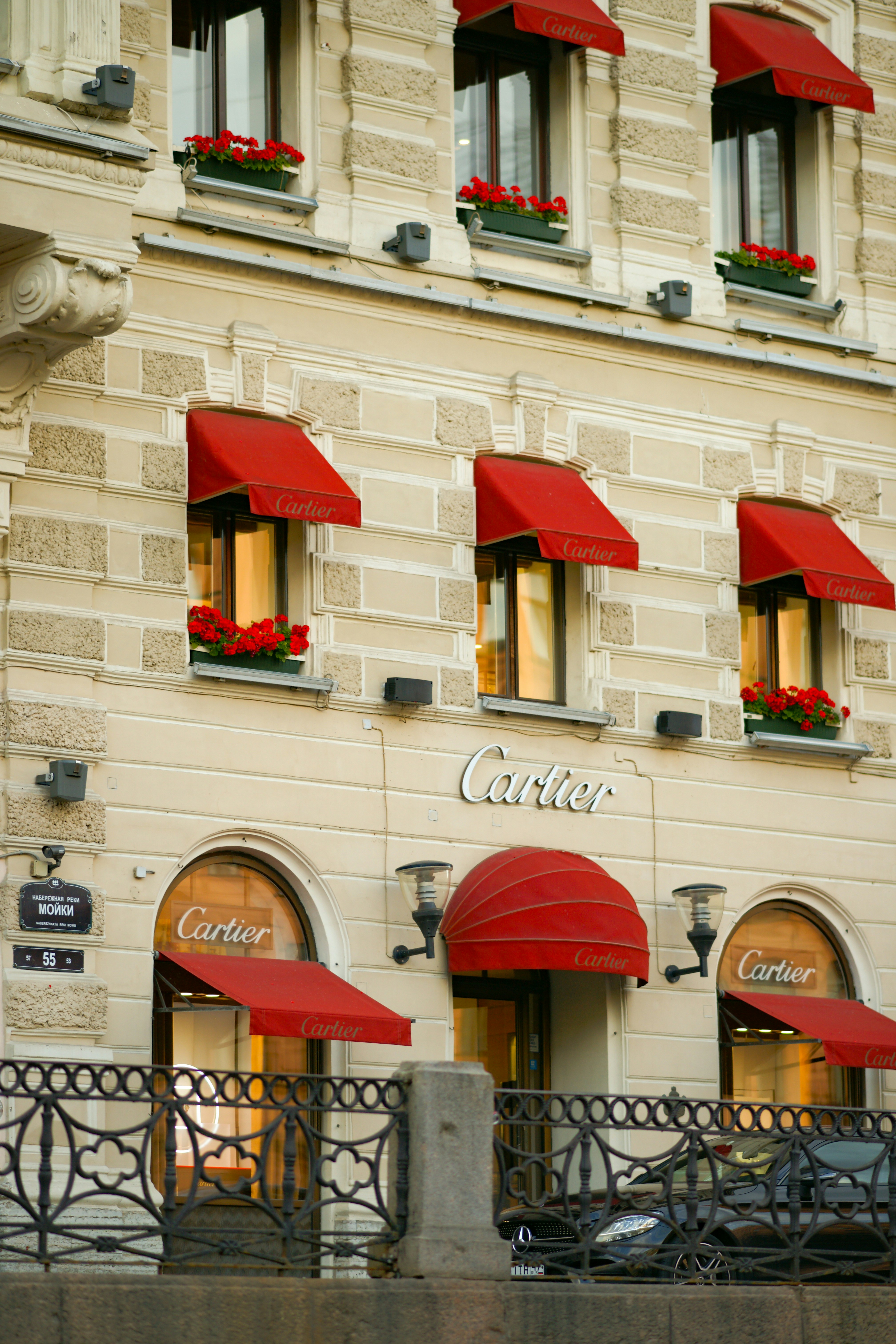 A building with red awnings on the windows photo – Free Awning Image on ...