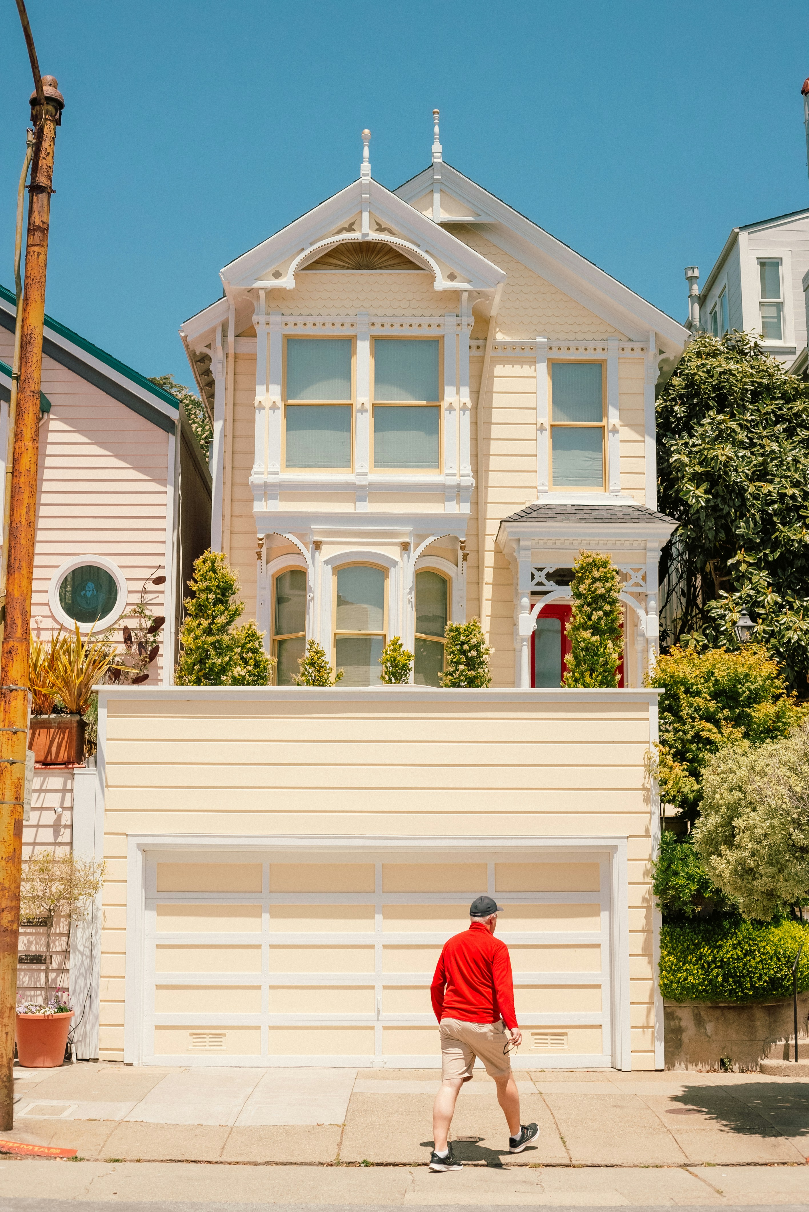 Red-hooded Stroll Before the Victorian House