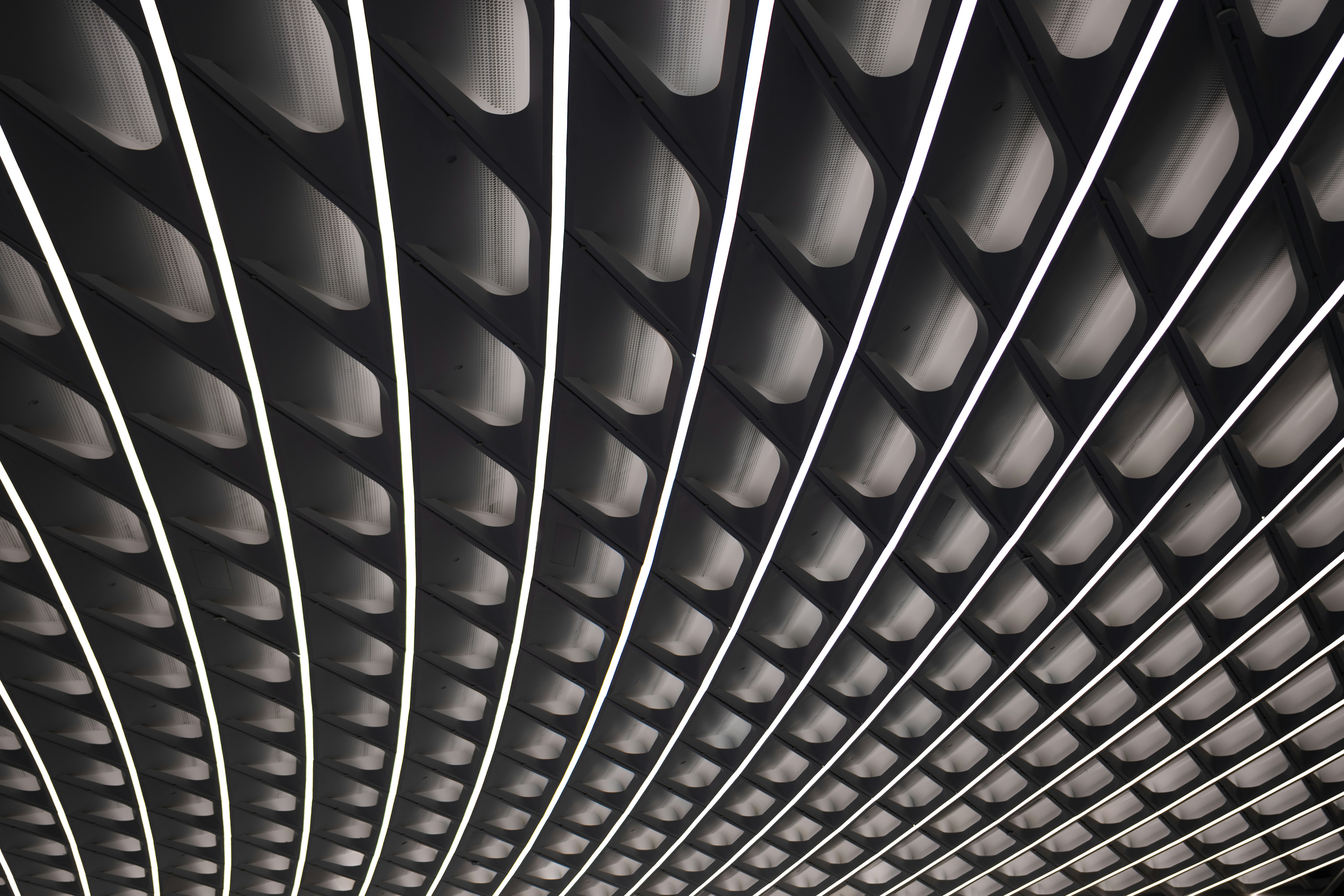 A large metal structure with a long walkway underneath it photo – Free ...