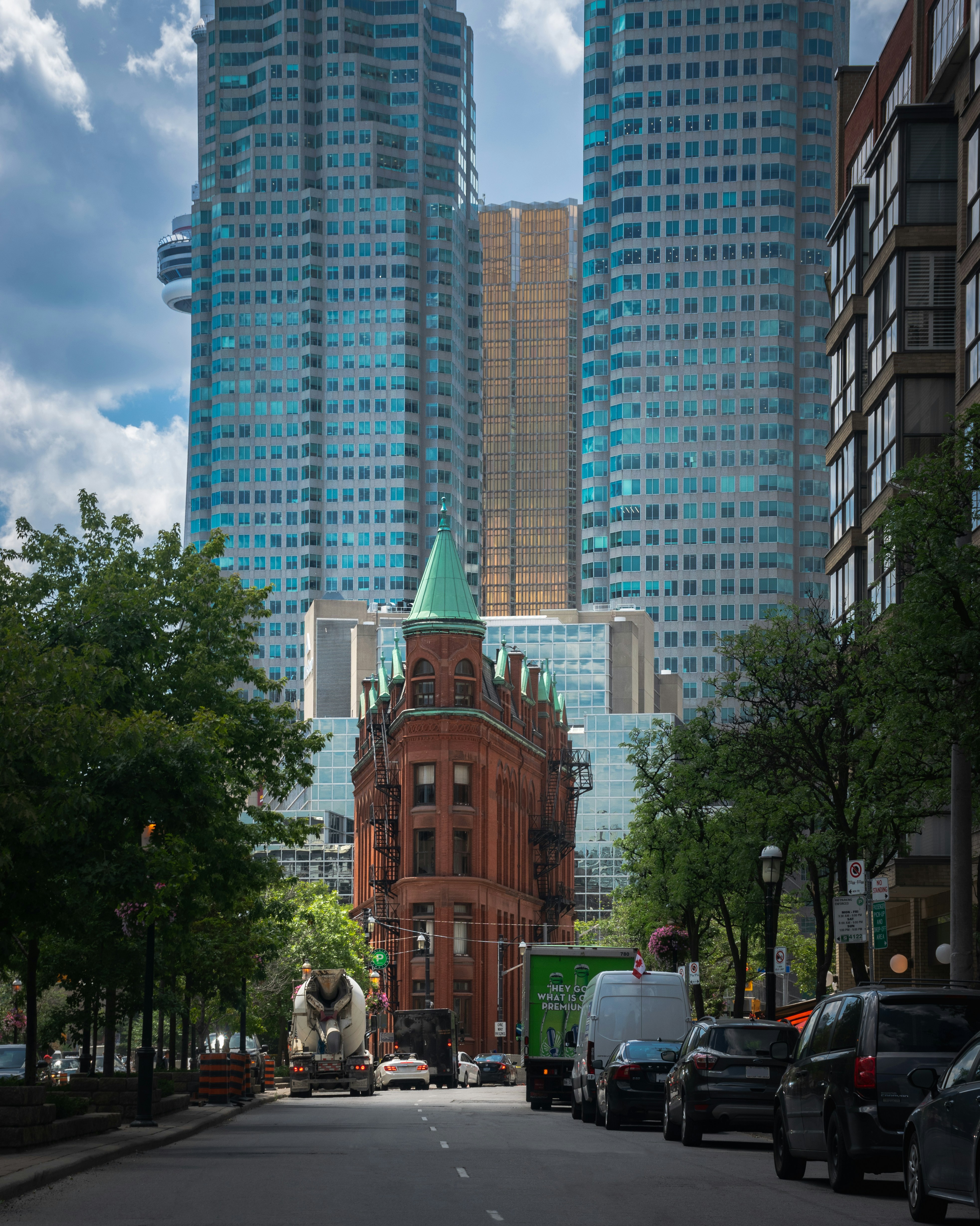 Red Brick Sentinel Between Glass Giants