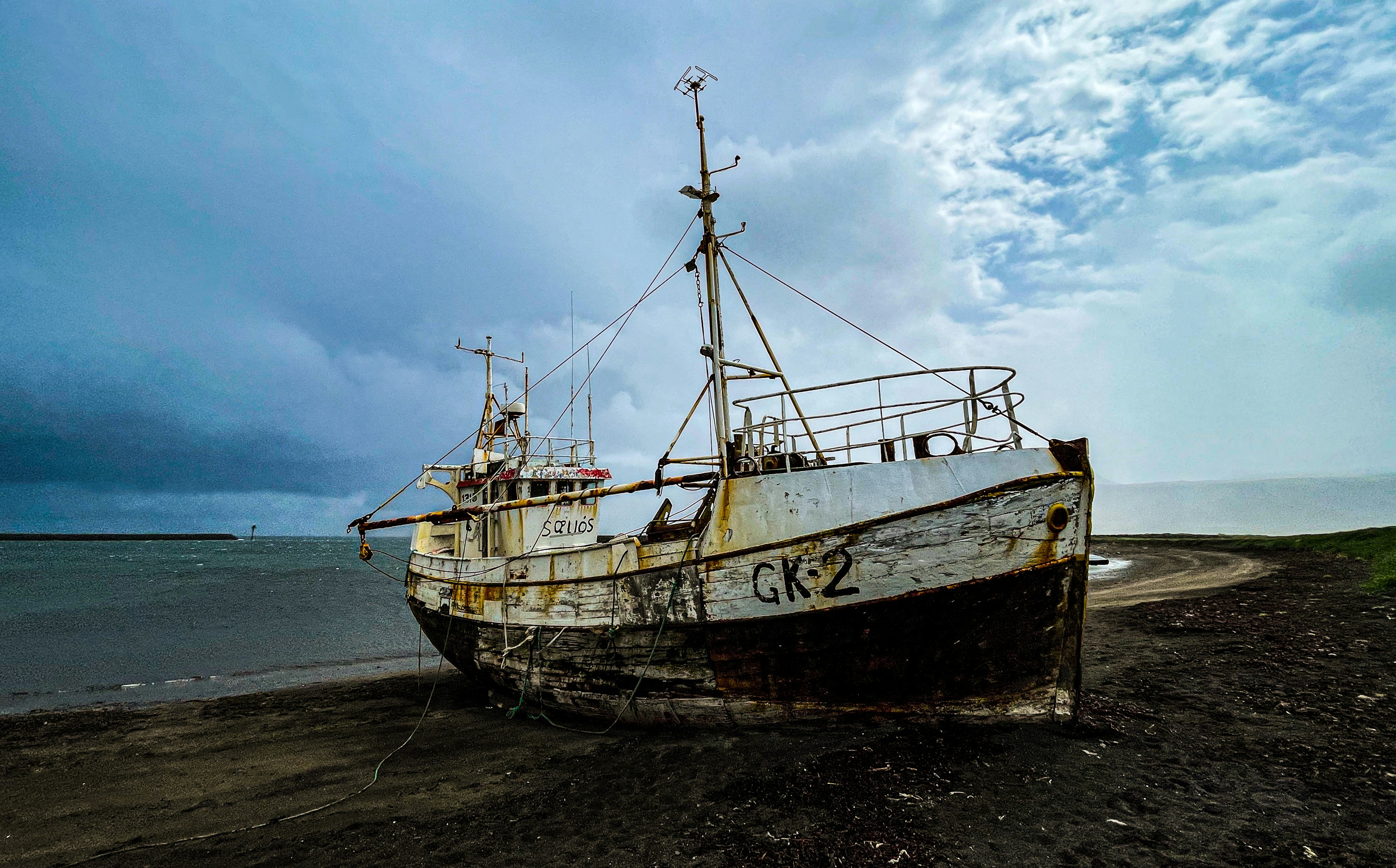 A rusted boat sitting on top of a beach photo – Free Snæfellsnes Image ...