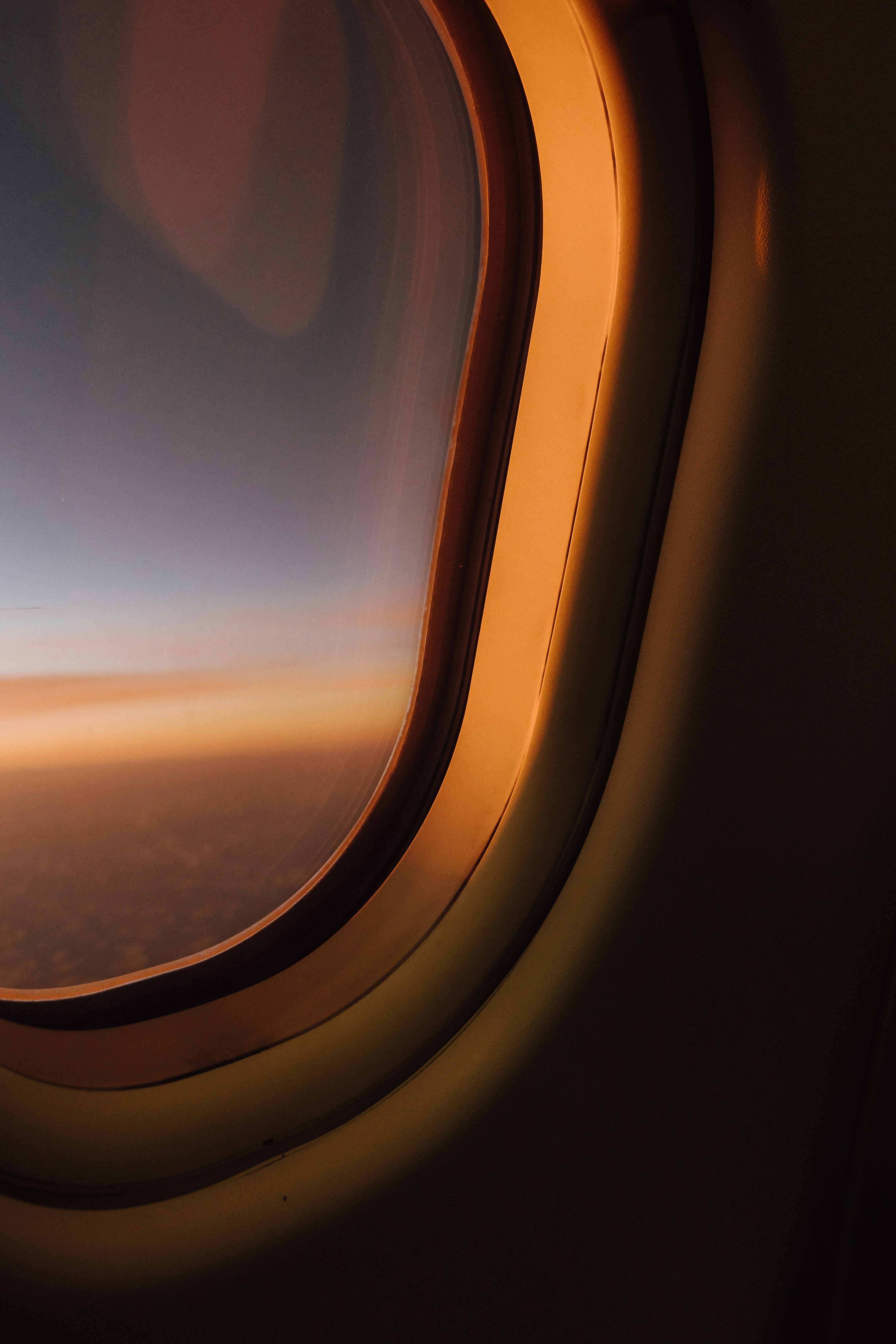 An airplane window with a view of the sky photo – Free Océan atlantique ...