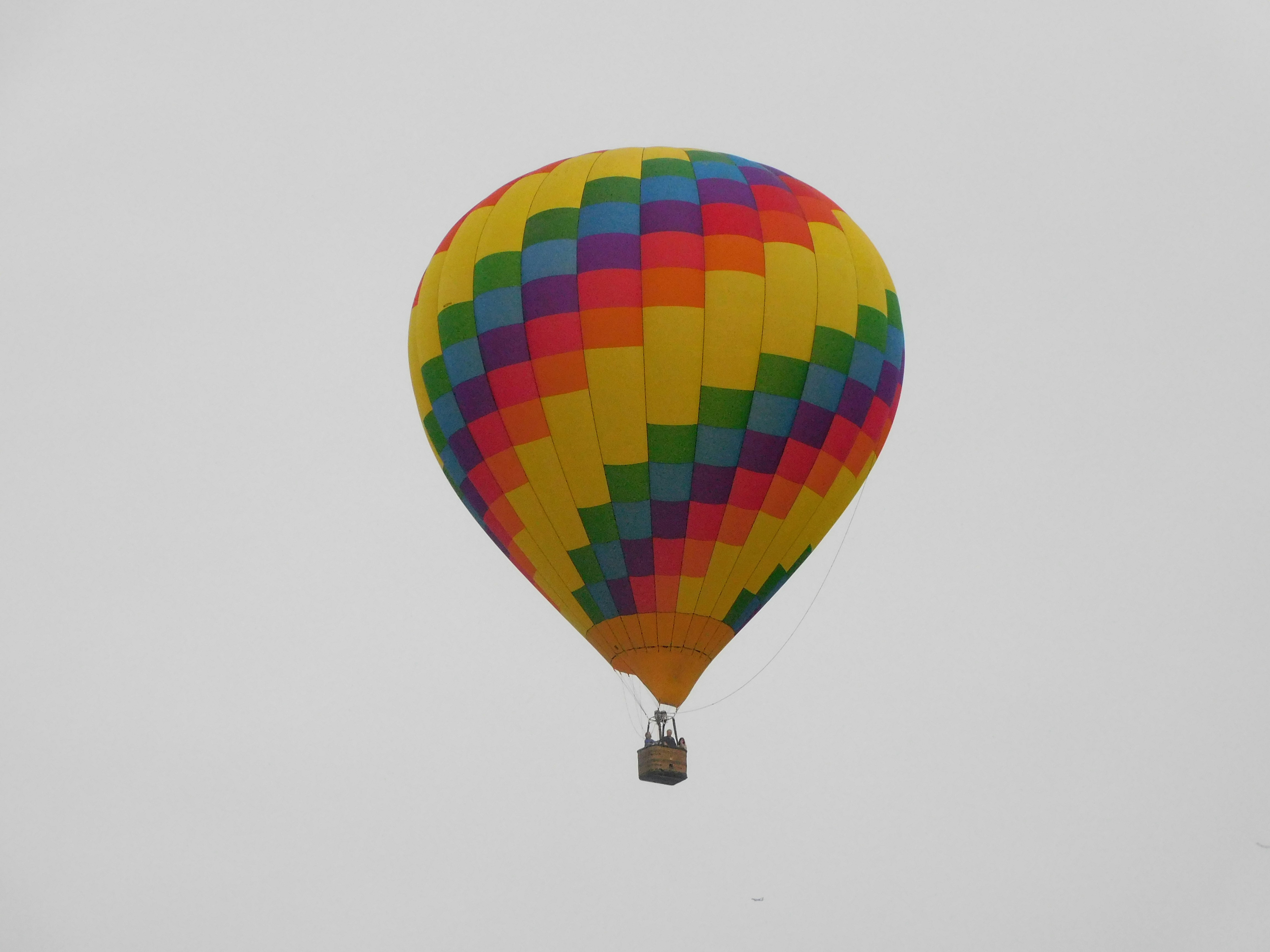 Hot air balloon over Ashland, VA. | a colorful hot air balloon flying in the sky