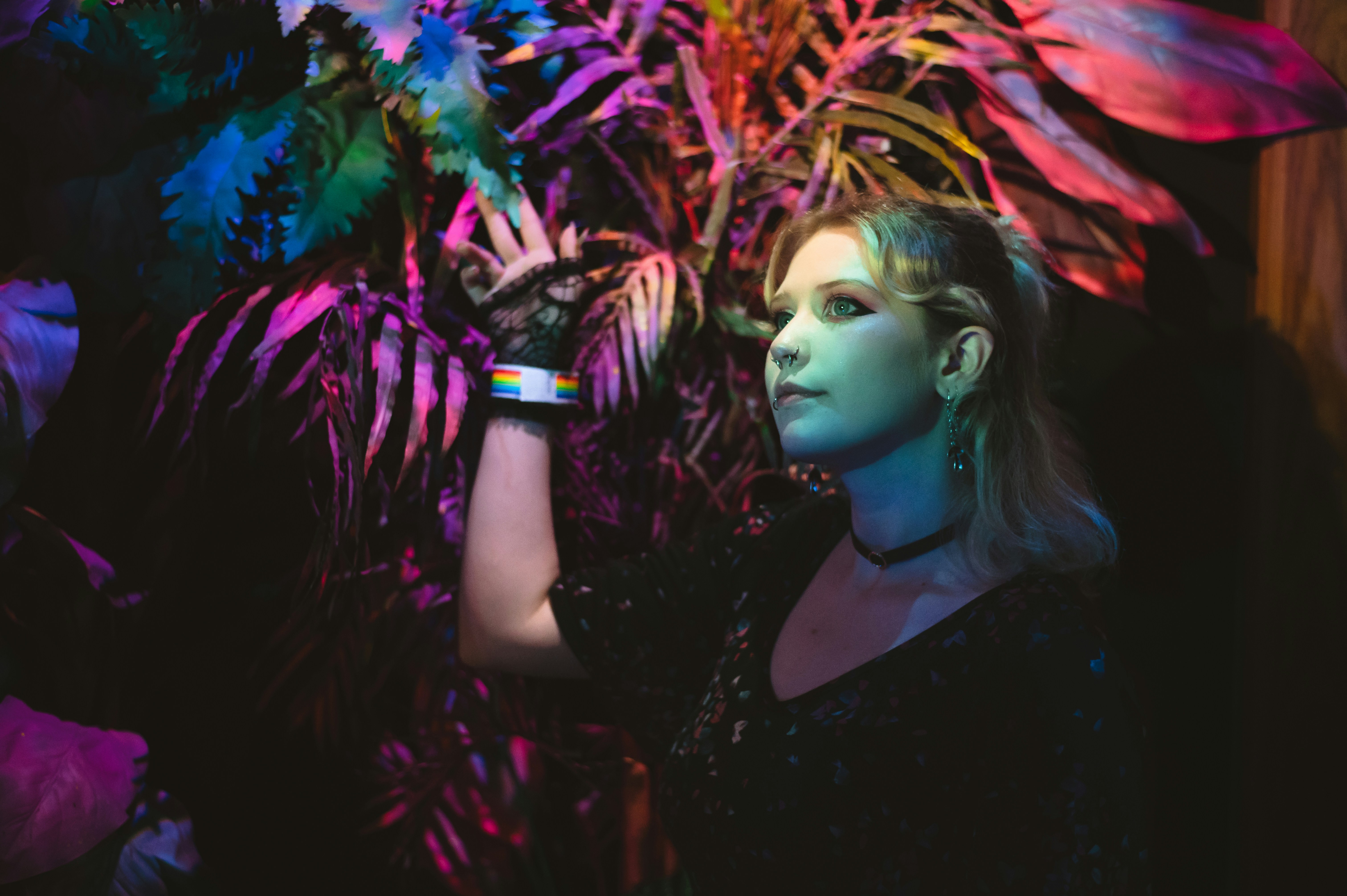 Neon Leaves and Velvet Glow: A Portrait Amid Foliage Night