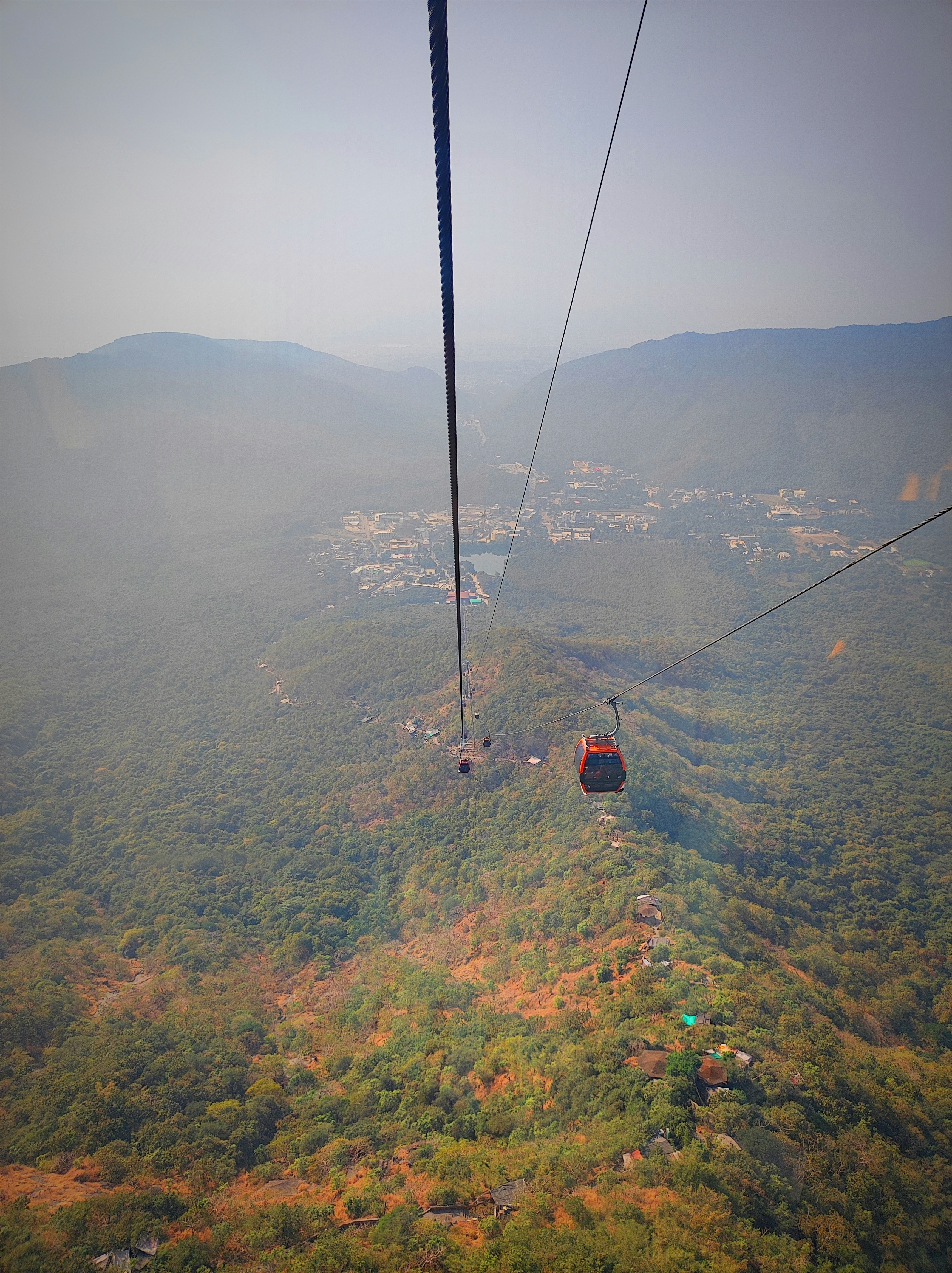 Cable Car Over a Sea of Green Valleys
