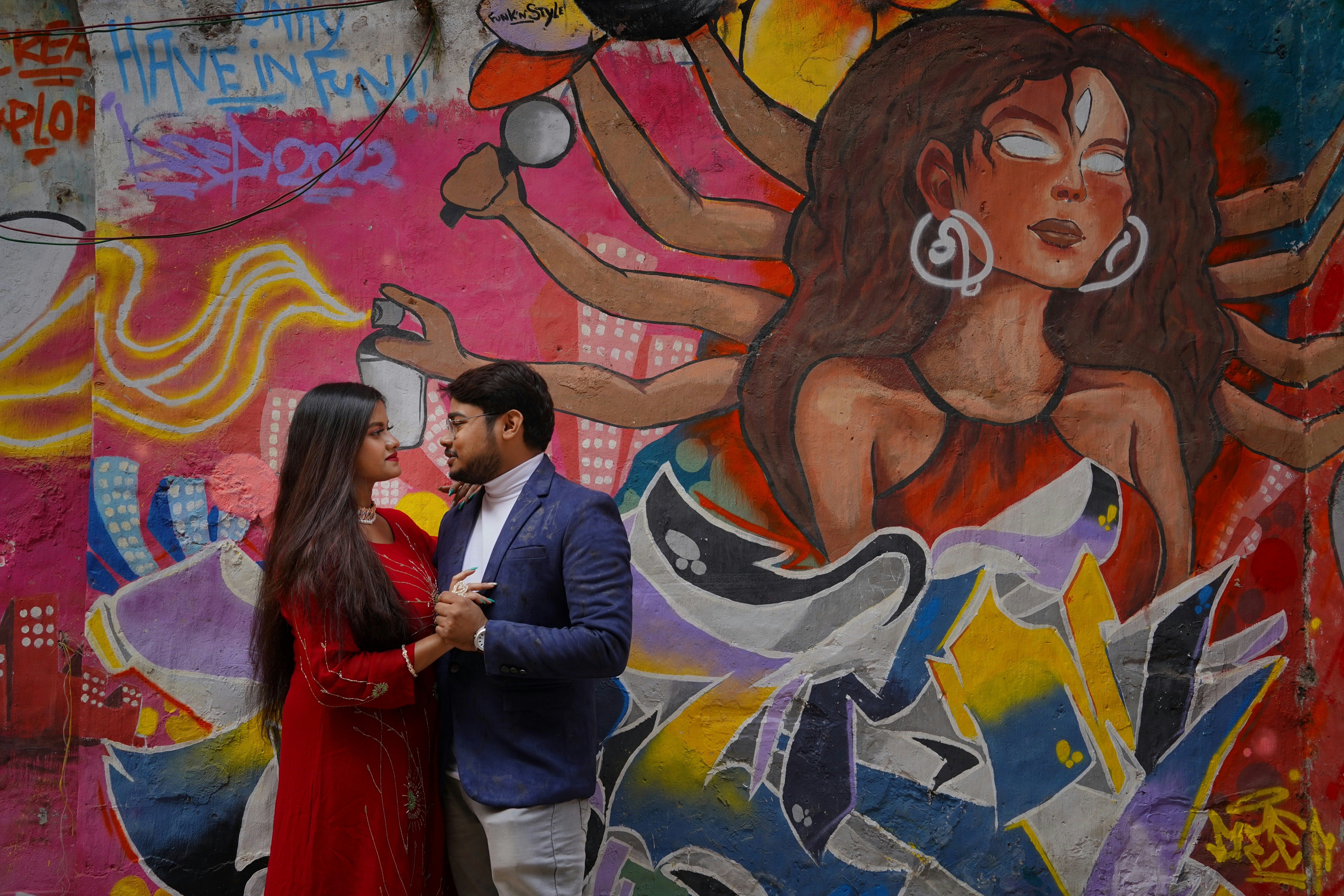 City mural Romance: A Couple in Front of Vivid Street Art