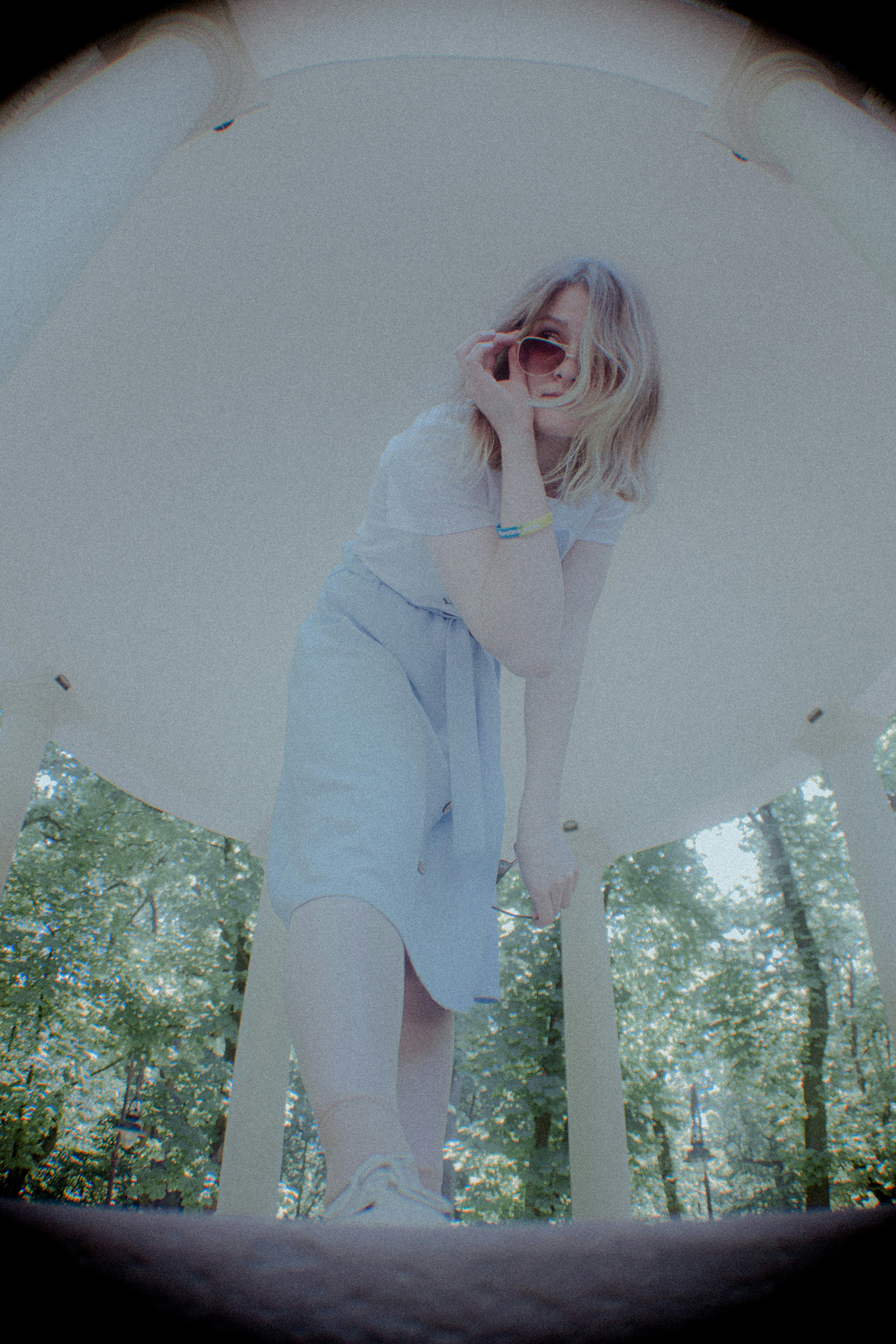Centered Glimpse beneath the Pavilion: A Sunlit Portrait under the Spherical Canopy