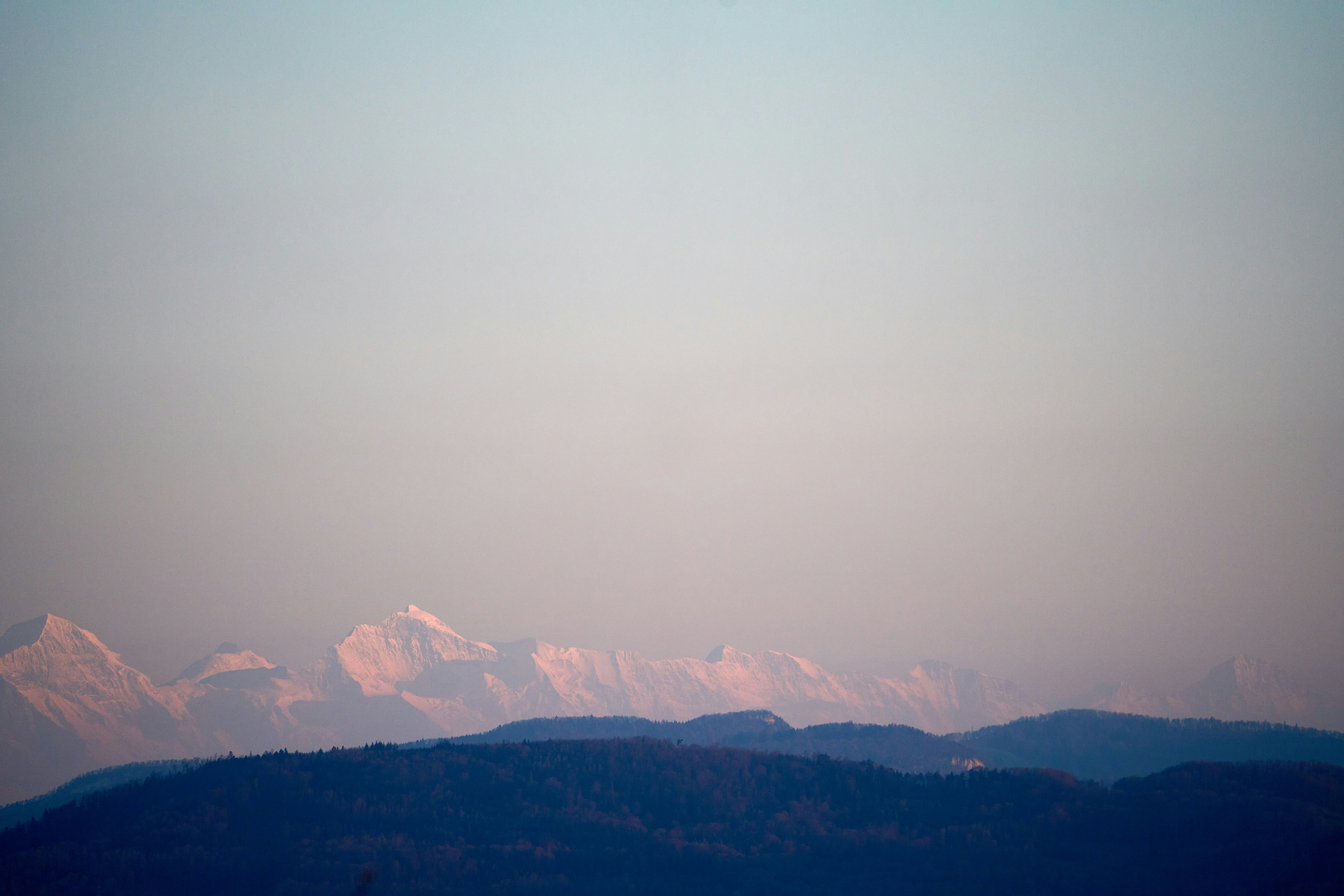 A view of a mountain range from a distance photo – Free Mountain Image ...