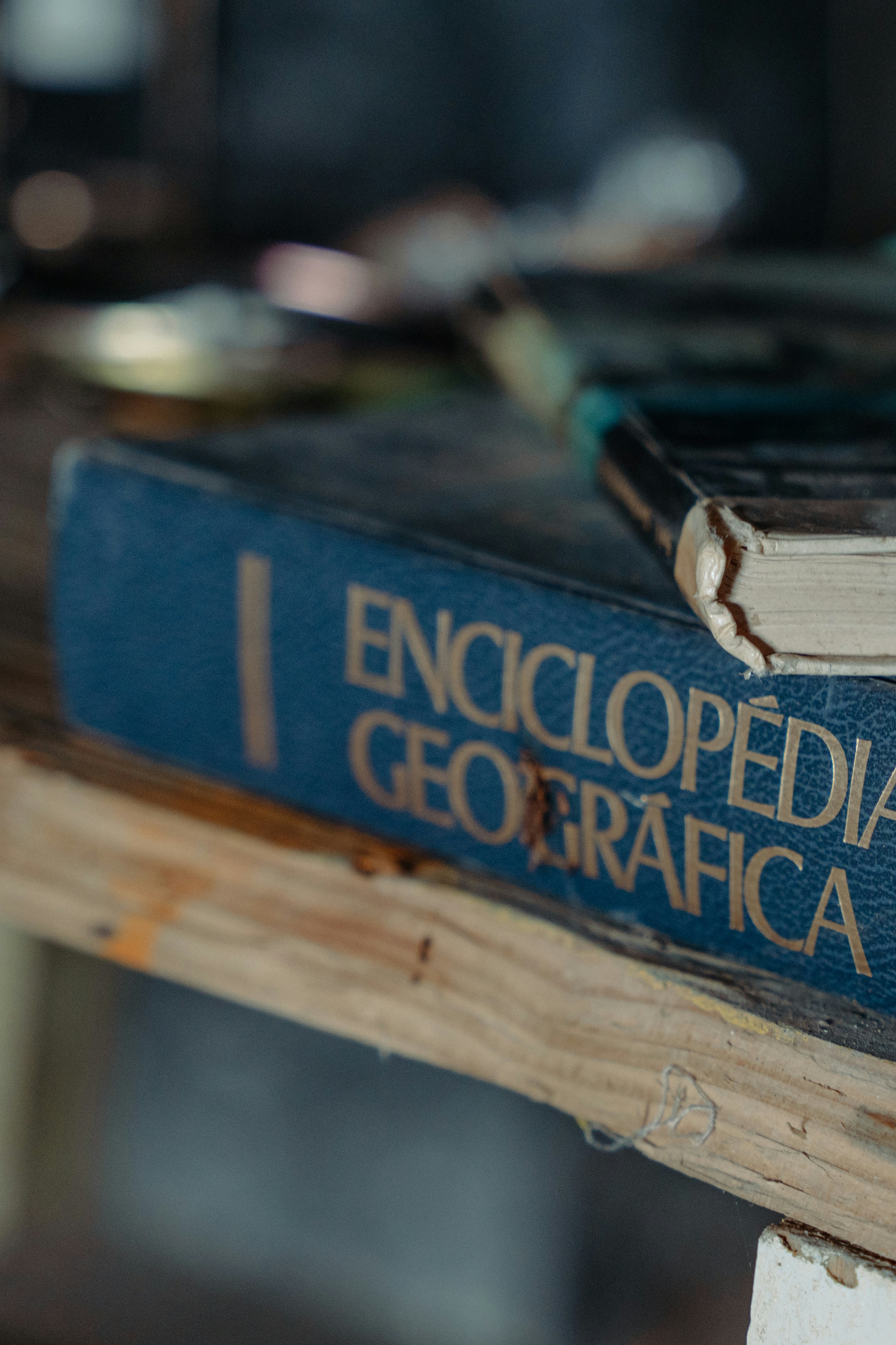 Edge of Knowledge: Weathered Geographical Encyclopedia on a Quiet Desk