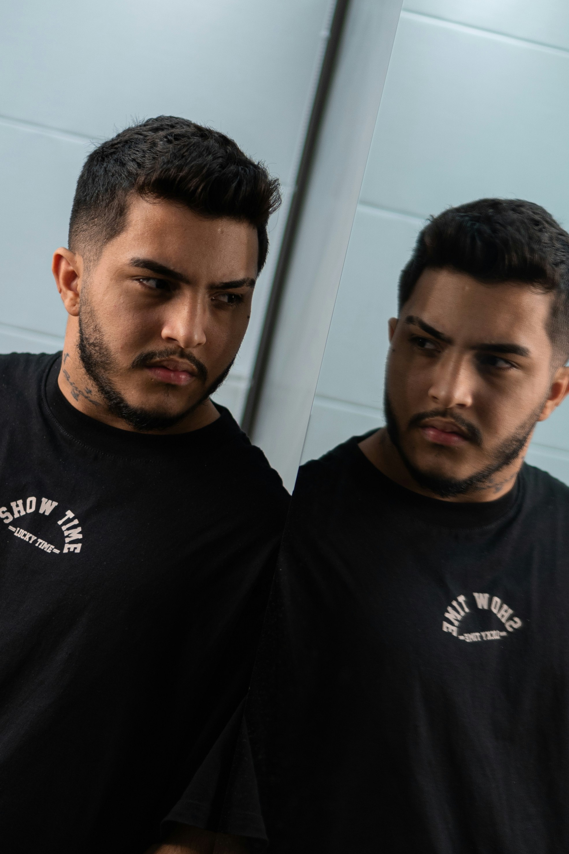 Two men standing next to each other in front of a mirror photo – Free ...