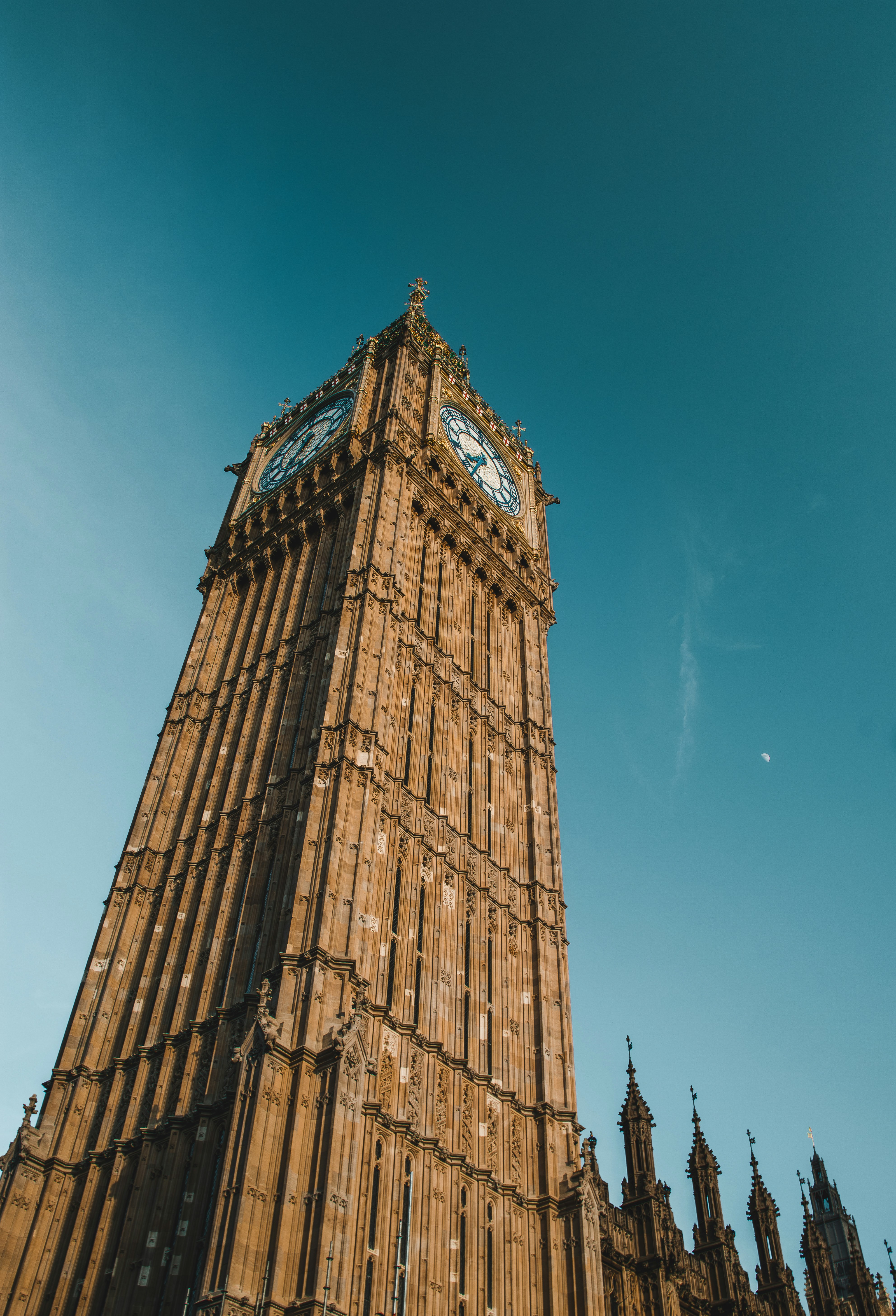 A tall clock tower towering over a city photo – Free Big ben Image on ...