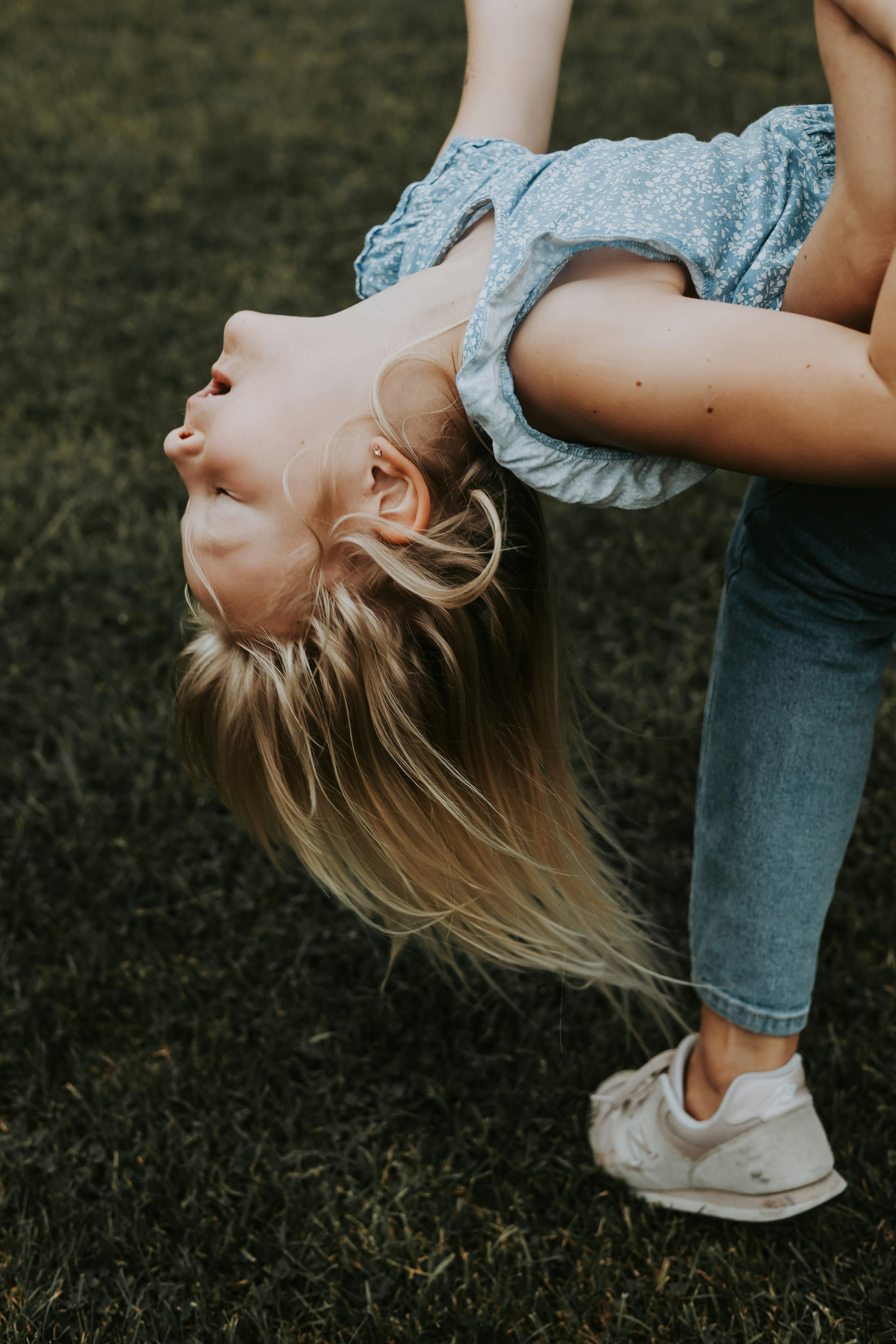 A little girl doing a handstand on the grass photo – Free Margitsziget ...