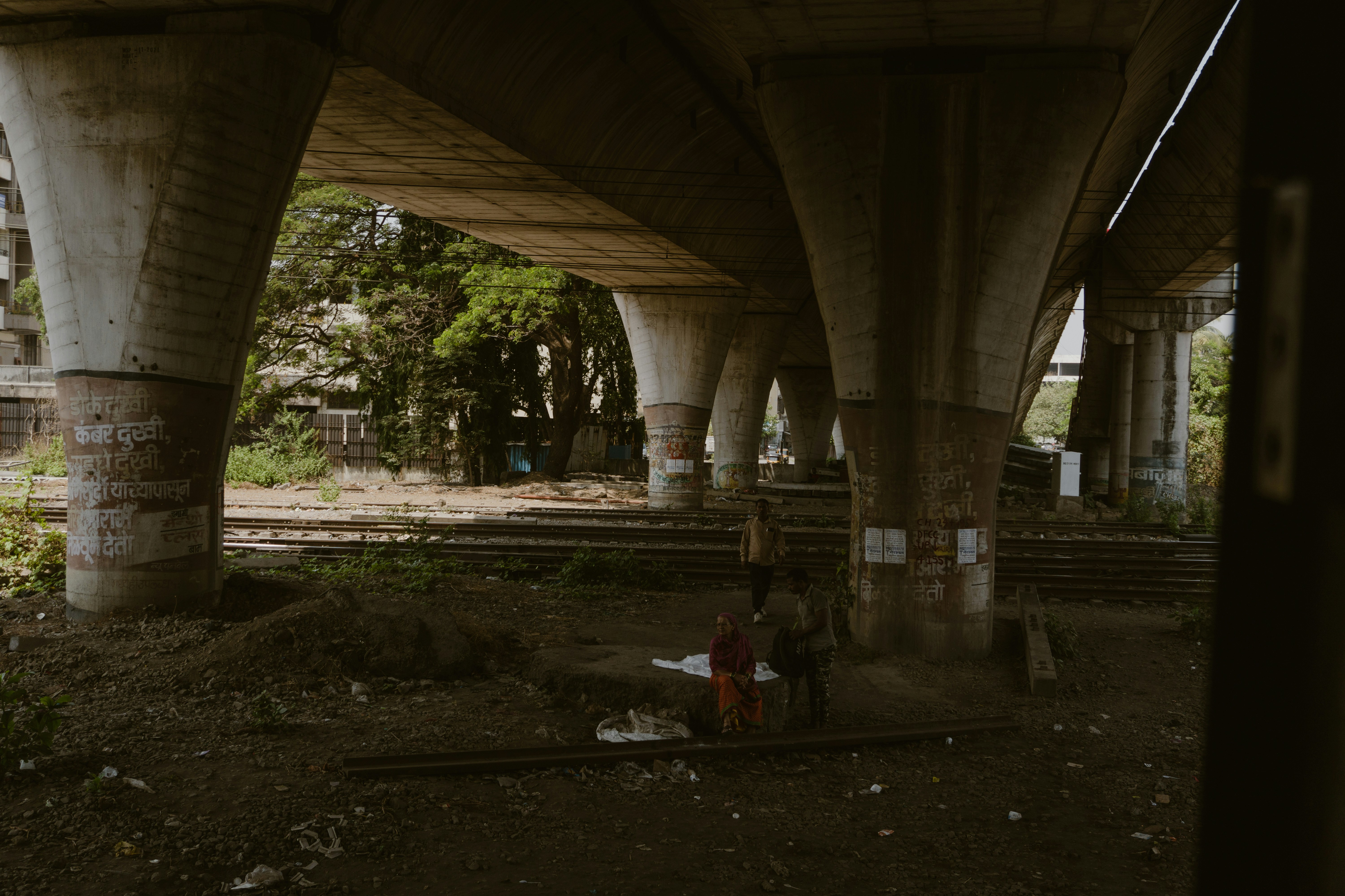 Under the Overpass: Quiet Moment by the Concrete Arches