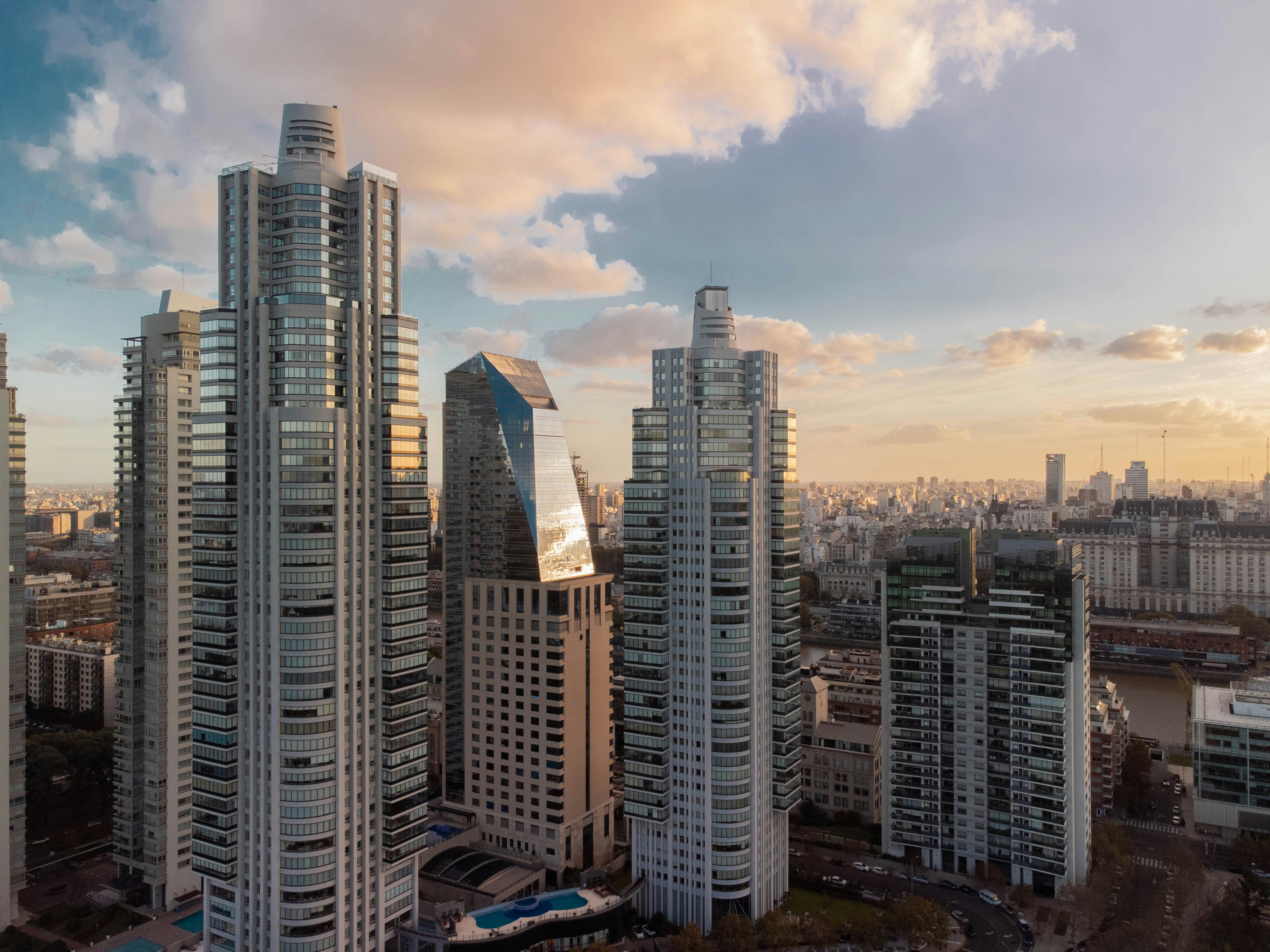 A group of tall buildings sitting next to each other photo – Free ...