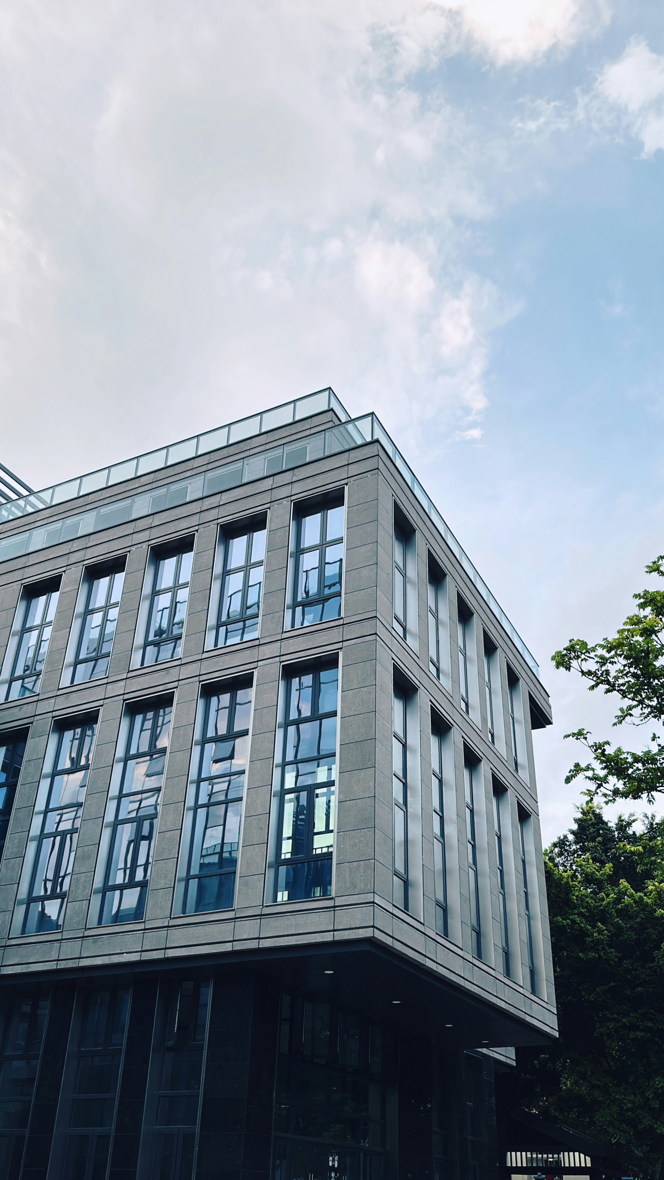 A tall building with lots of windows on top of it photo – Free Building ...