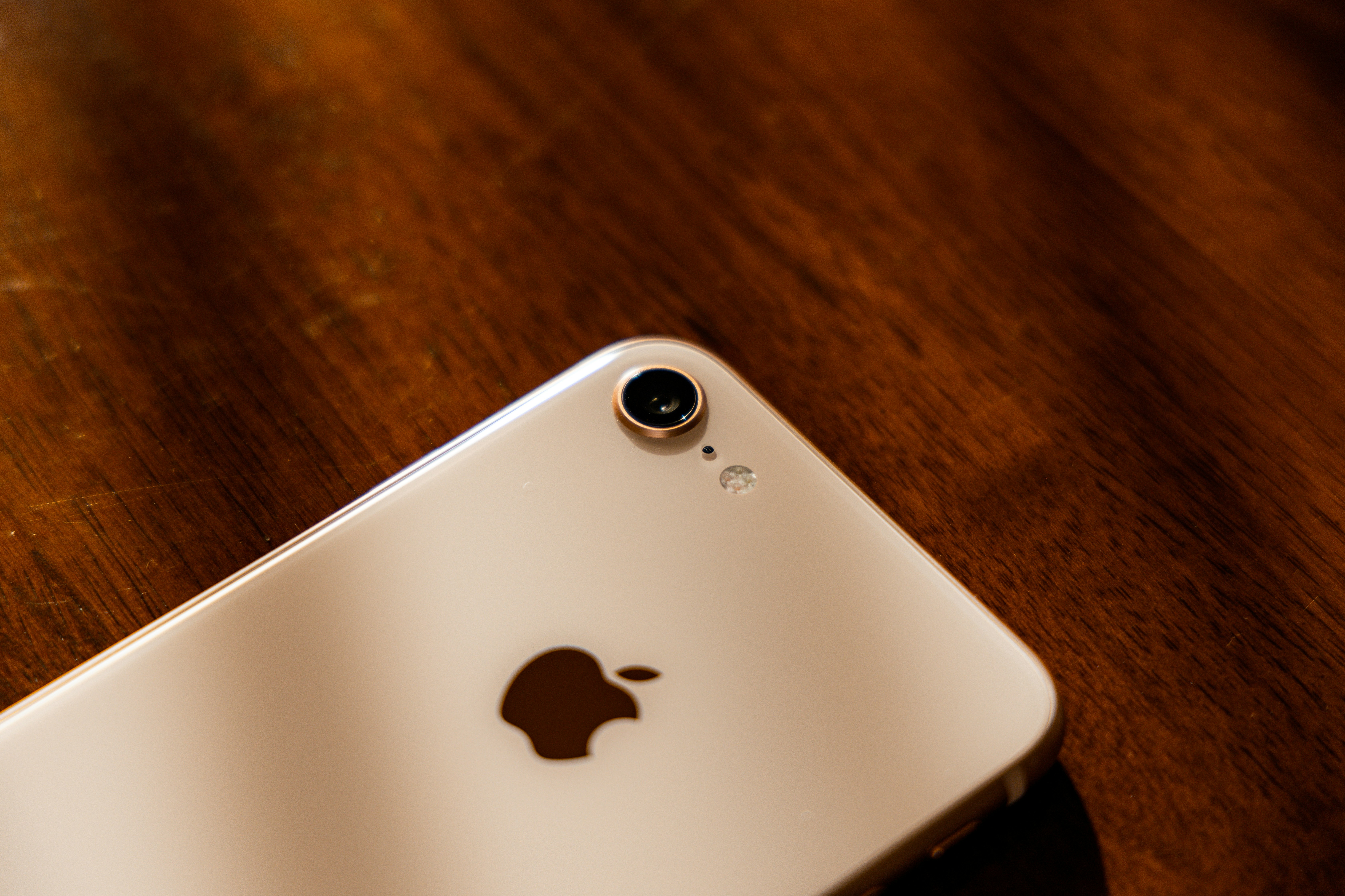 A close up of an iphone on a wooden table photo – Free Iphone Image on ...