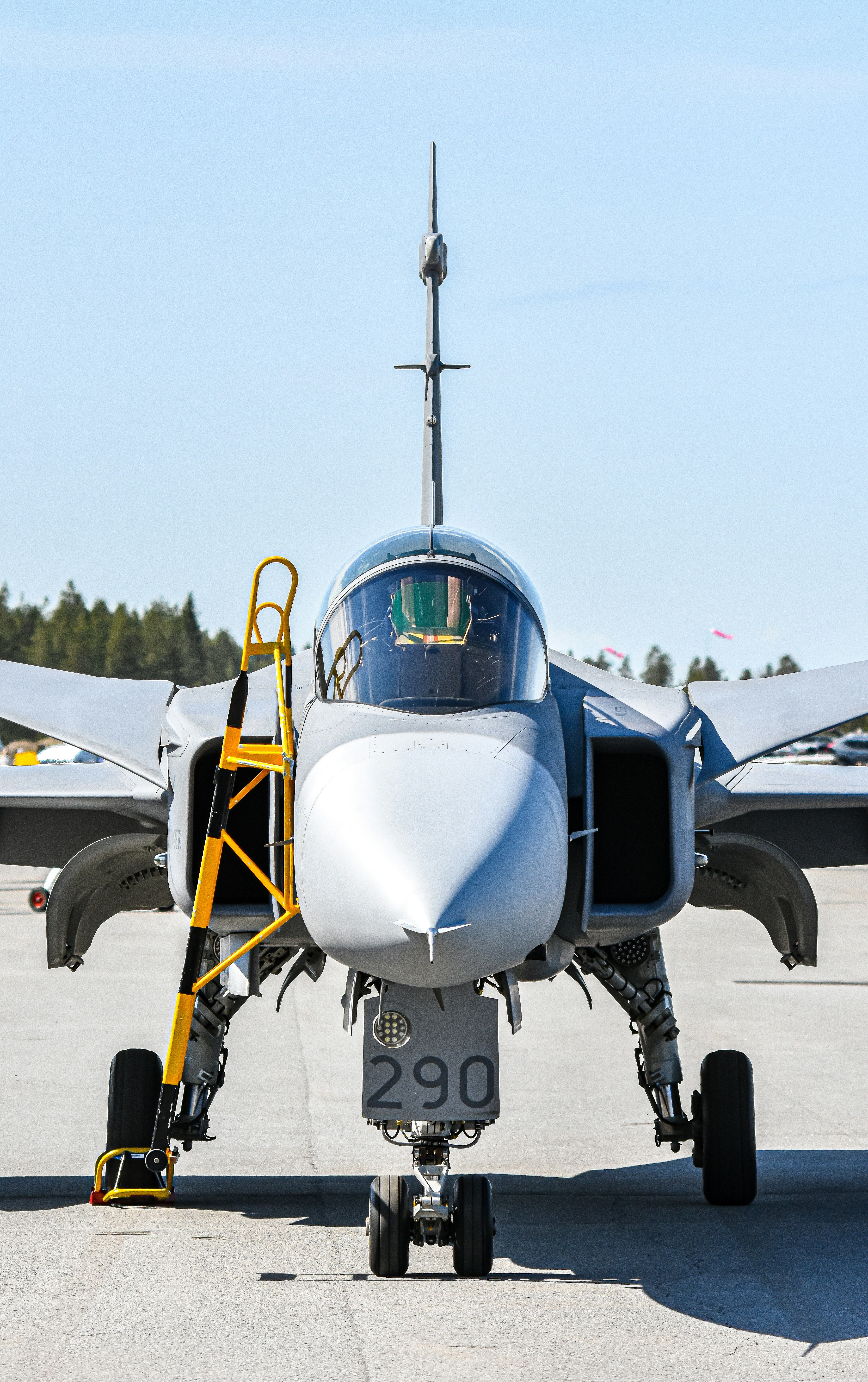 Front-on Fighter Jet on the Apron with a Bright Yellow Maintenance Ladder
