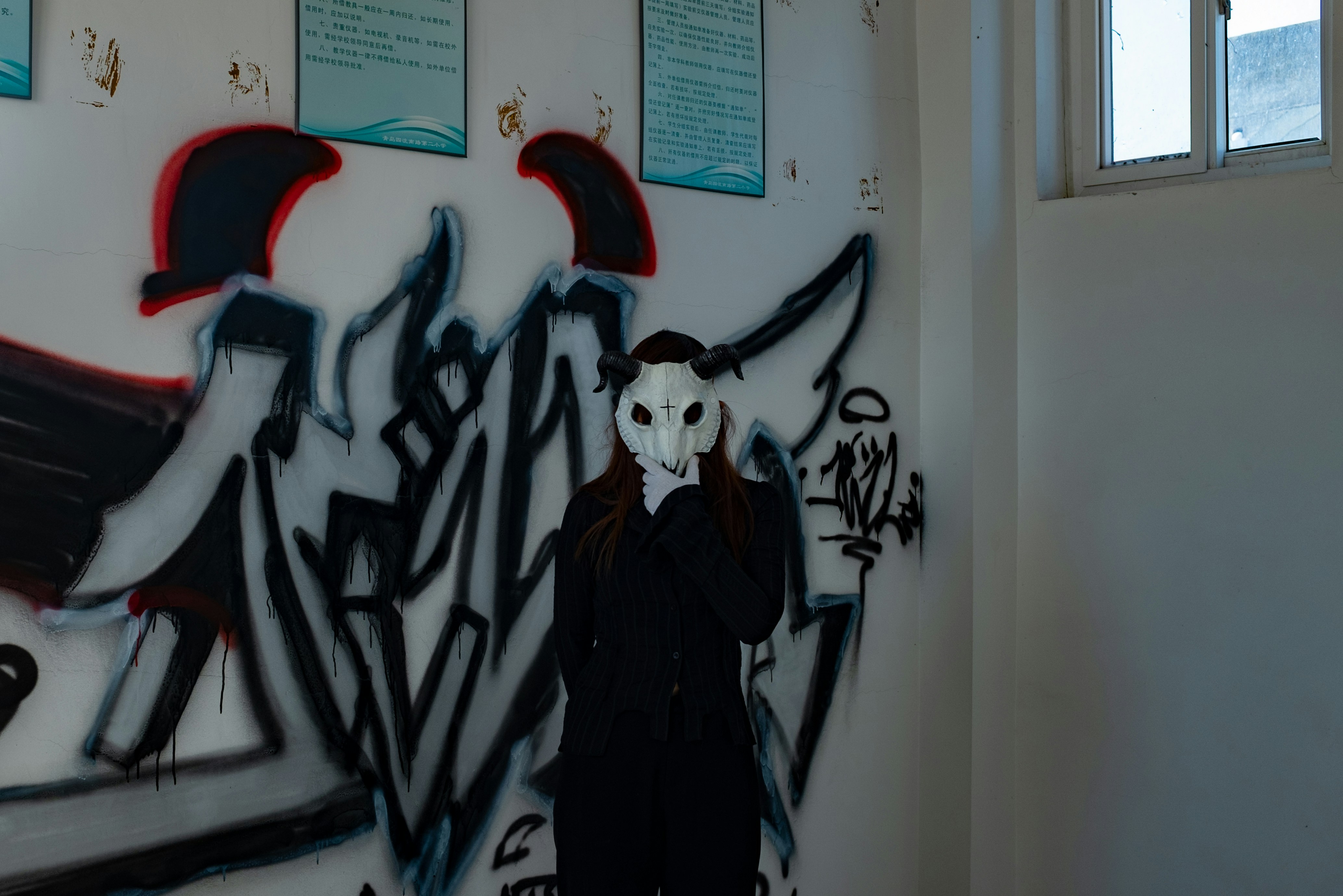 A person standing in front of a wall covered in graffiti photo – Free ...