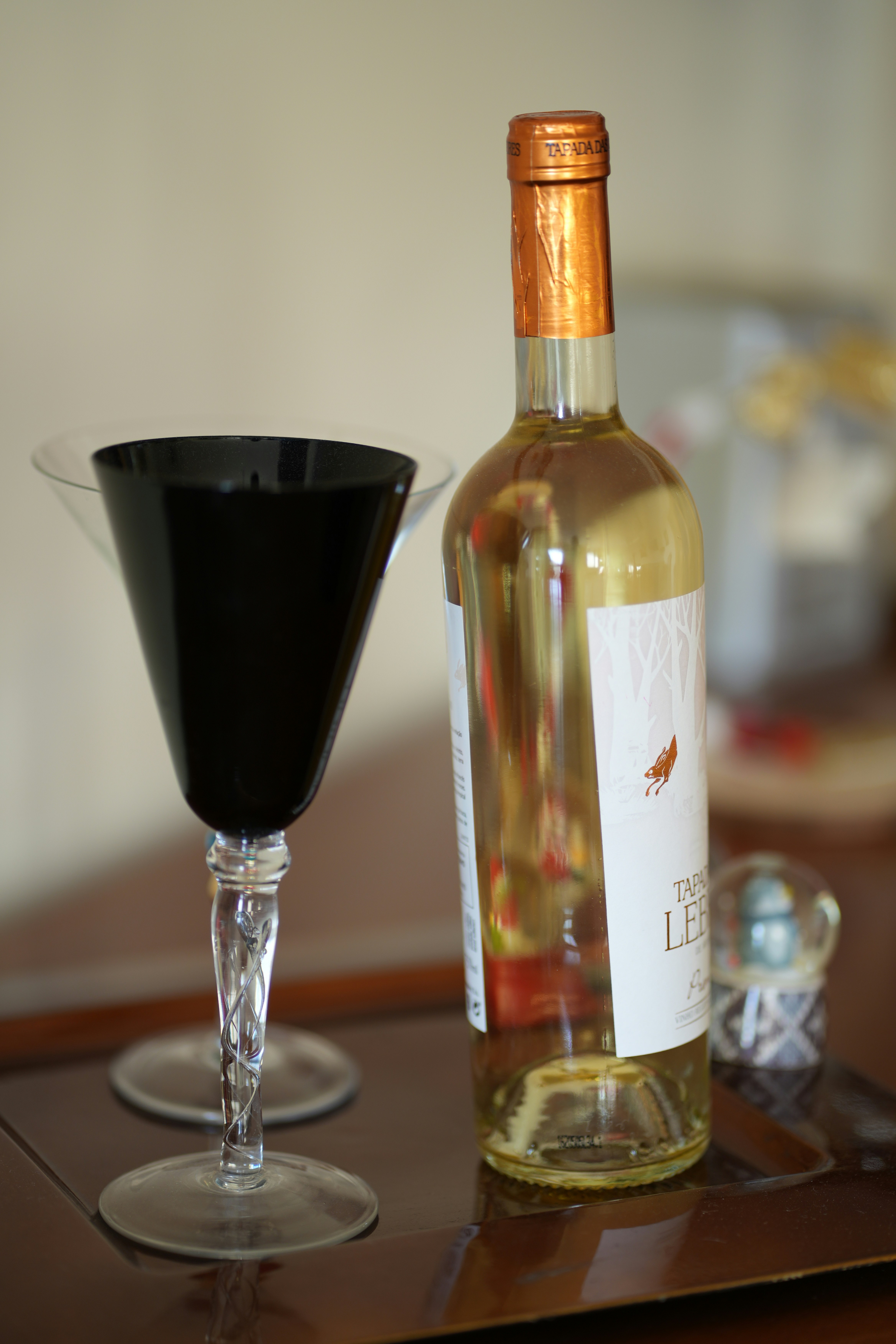 Amber Neck and Quiet Glass: A Still-Life Moment on a Wooden Tray