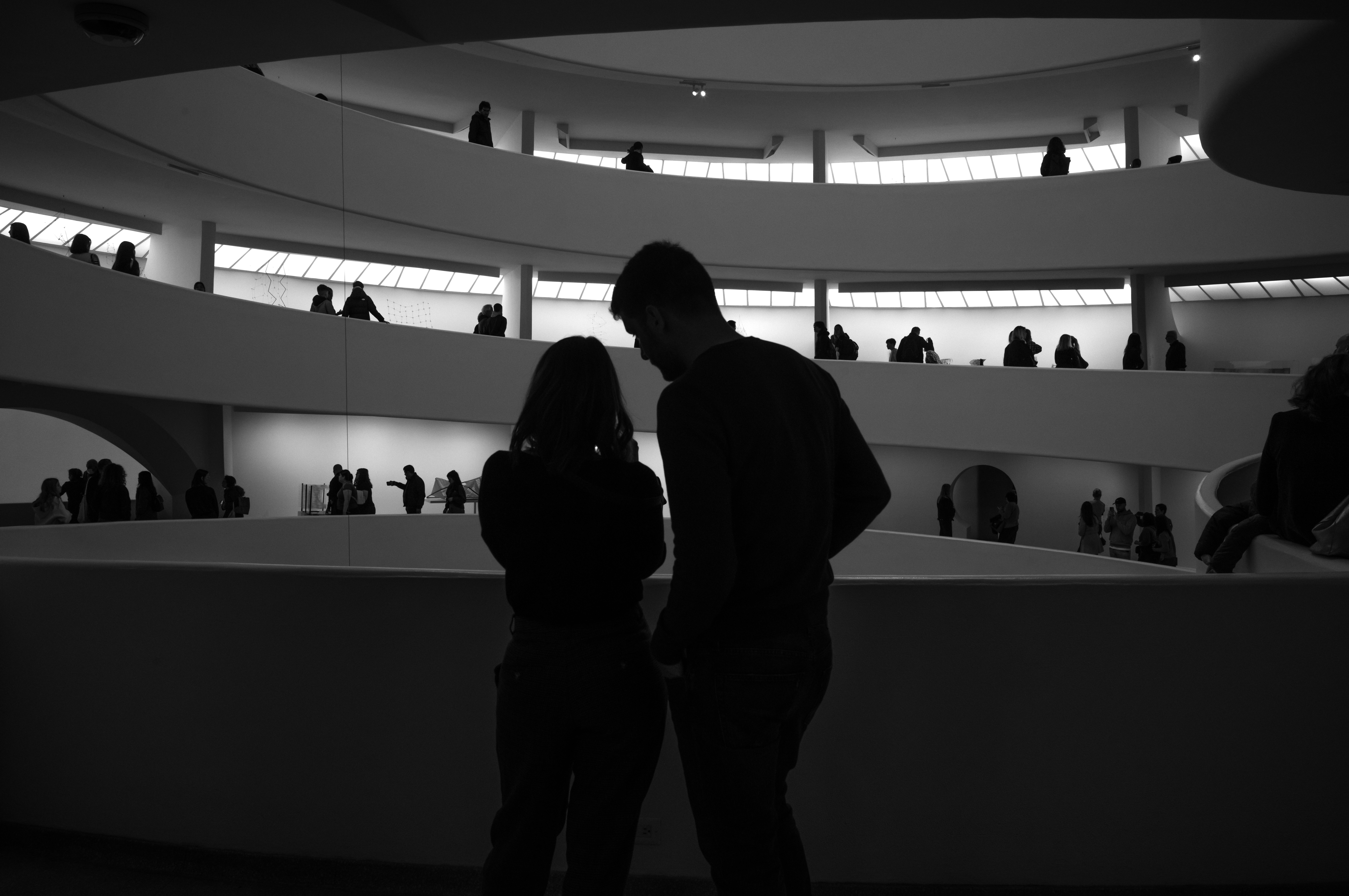 A man and a woman standing in front of a circular room photo – Free ...
