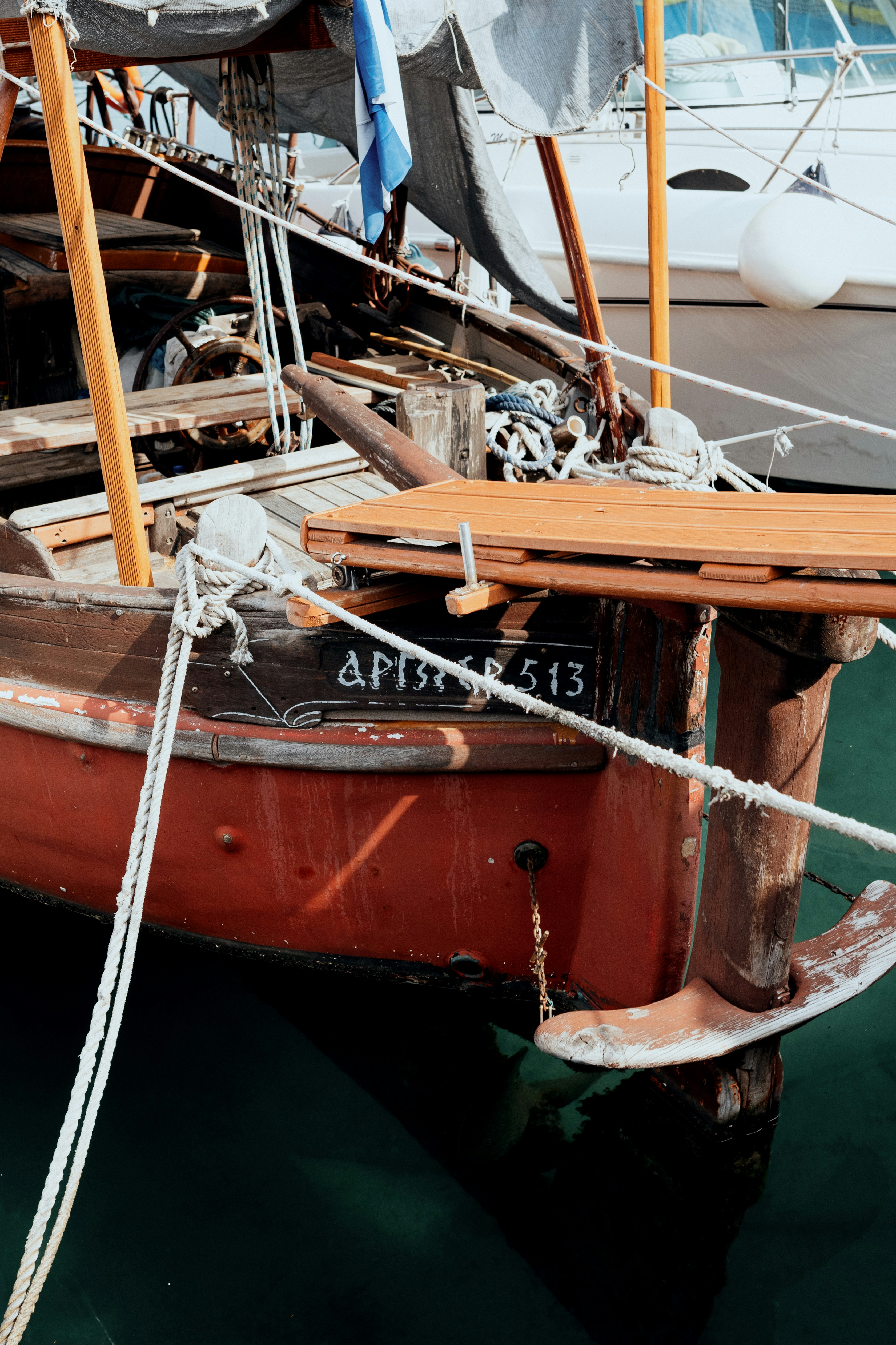 Ropes, Wood, and the Red Hull: A Mooring Portrait